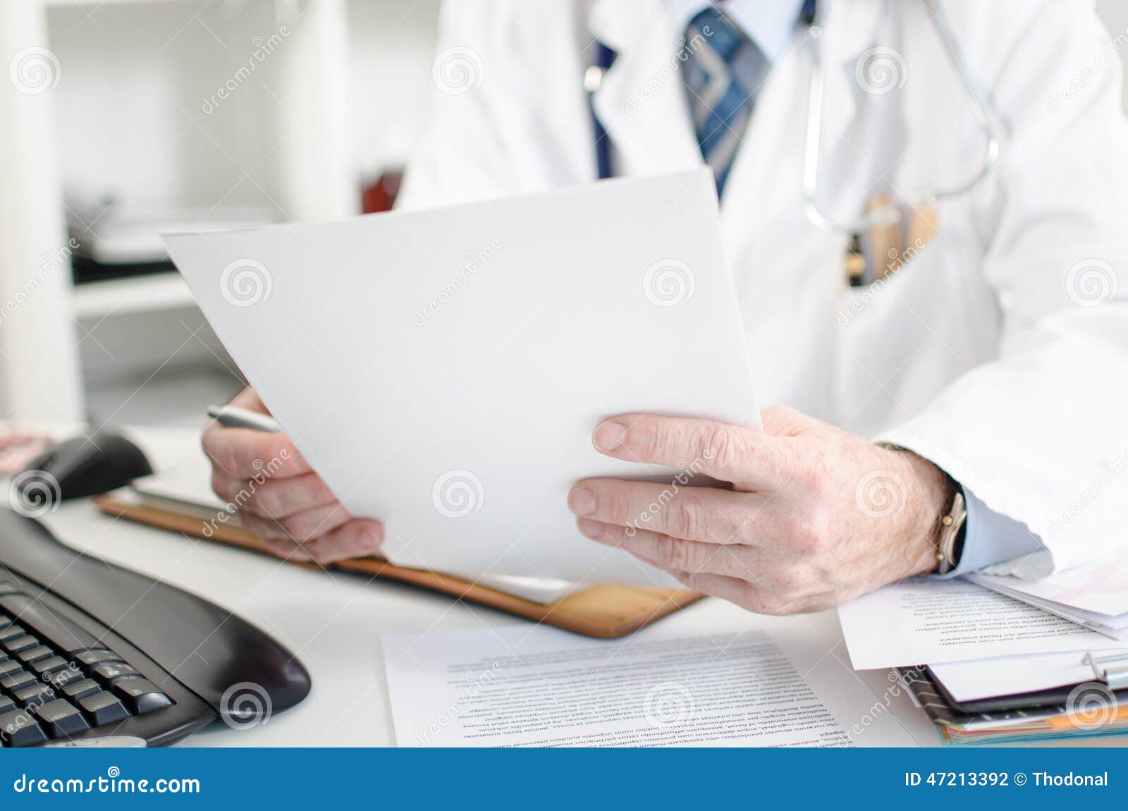 Doctor Reading Medical Notes Stock Photo - Image of hospital, care ...