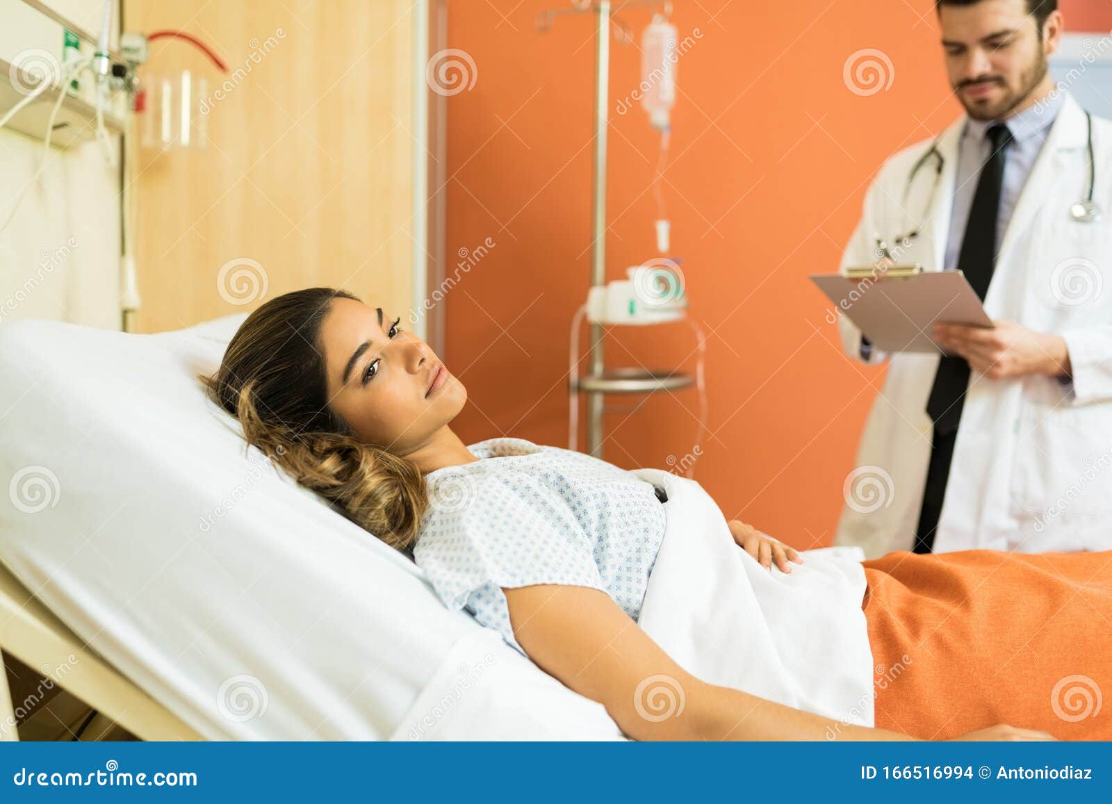 Doctor Reading Reports To Sad Patient at Hospital Stock Photo - Image ...