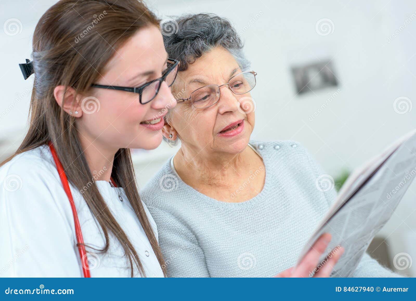 Doctor reading to patient stock photo. Image of glasses - 84627940