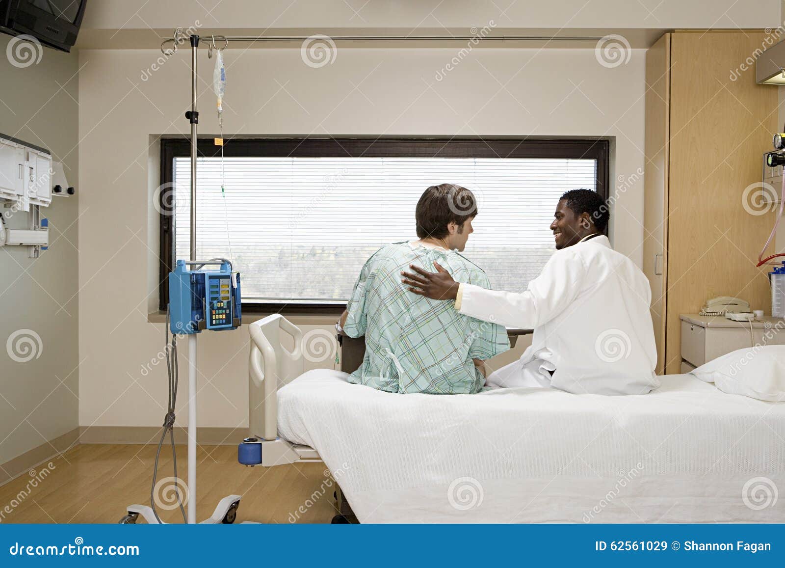 Doctor reassuring patient stock image. Image of medical - 62561029