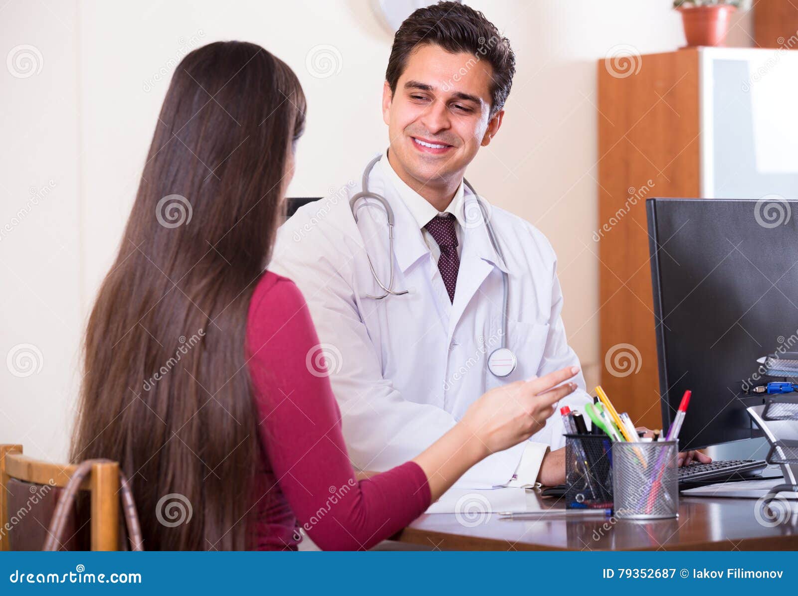 Doctor Receiving Ill Patient Stock Image - Image of american, computer ...