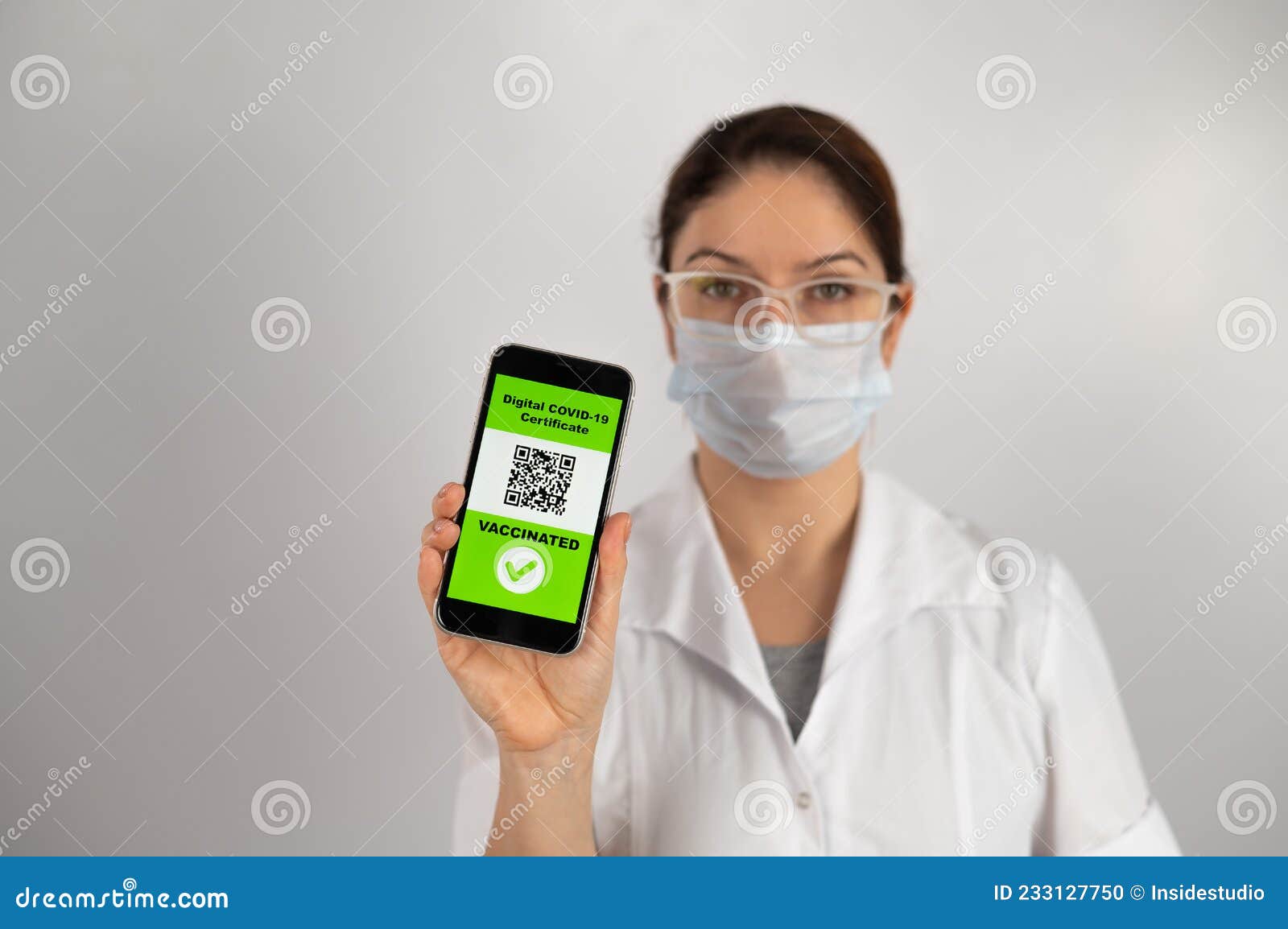The Doctor Recommends Vaccination and Holds a Smartphone with a QR Code ...