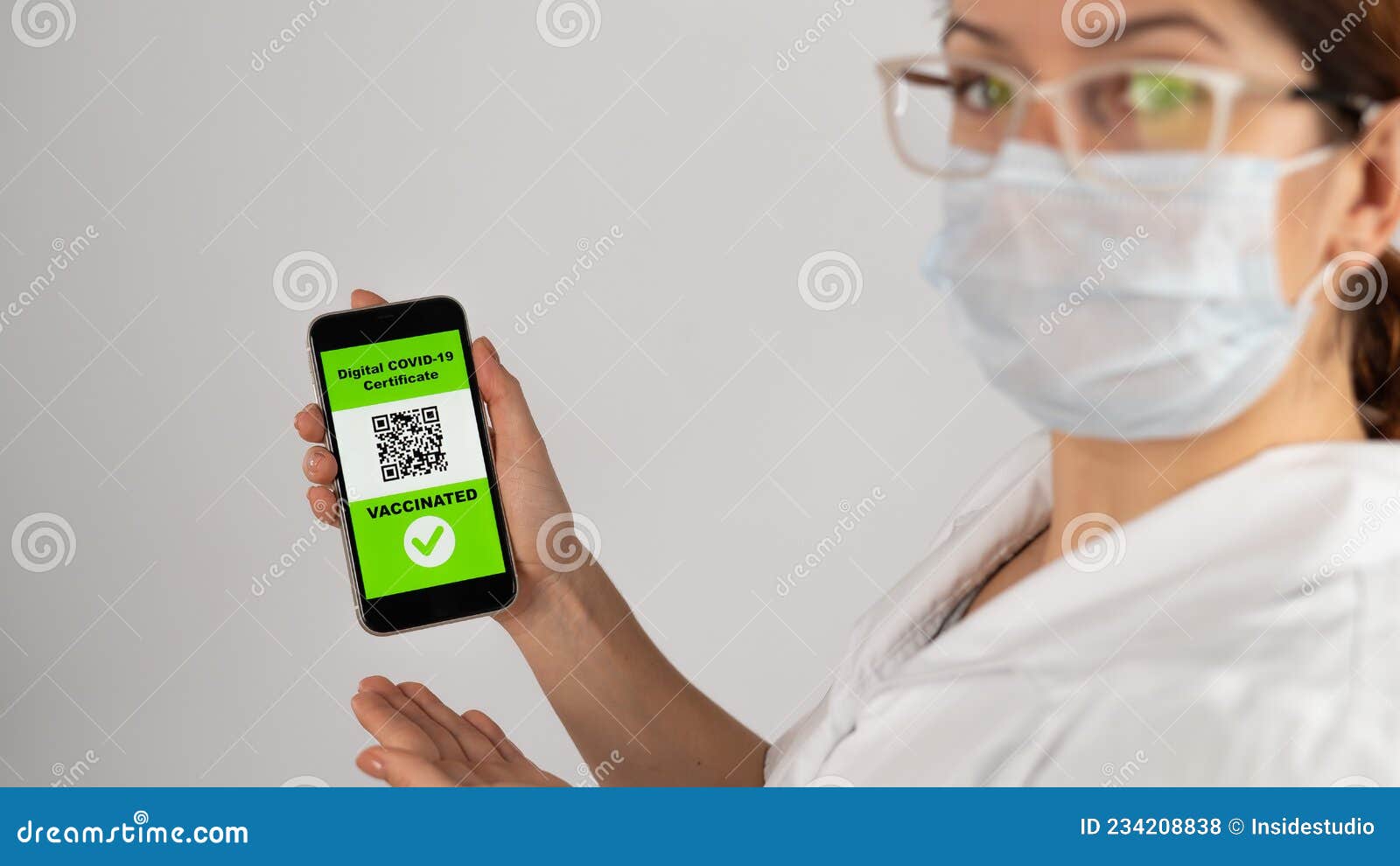The Doctor Recommends Vaccination and Holds a Smartphone with a QR Code ...