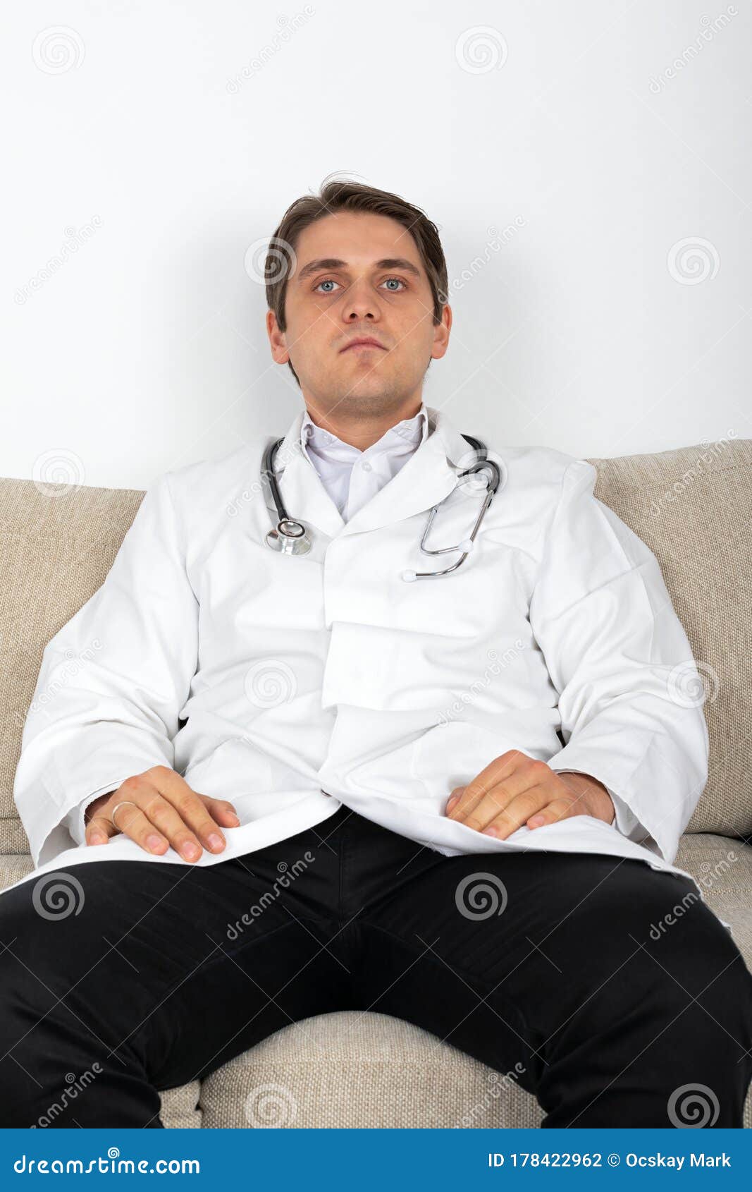 Doctor Relaxing on the Sofa Stock Photo - Image of confident ...
