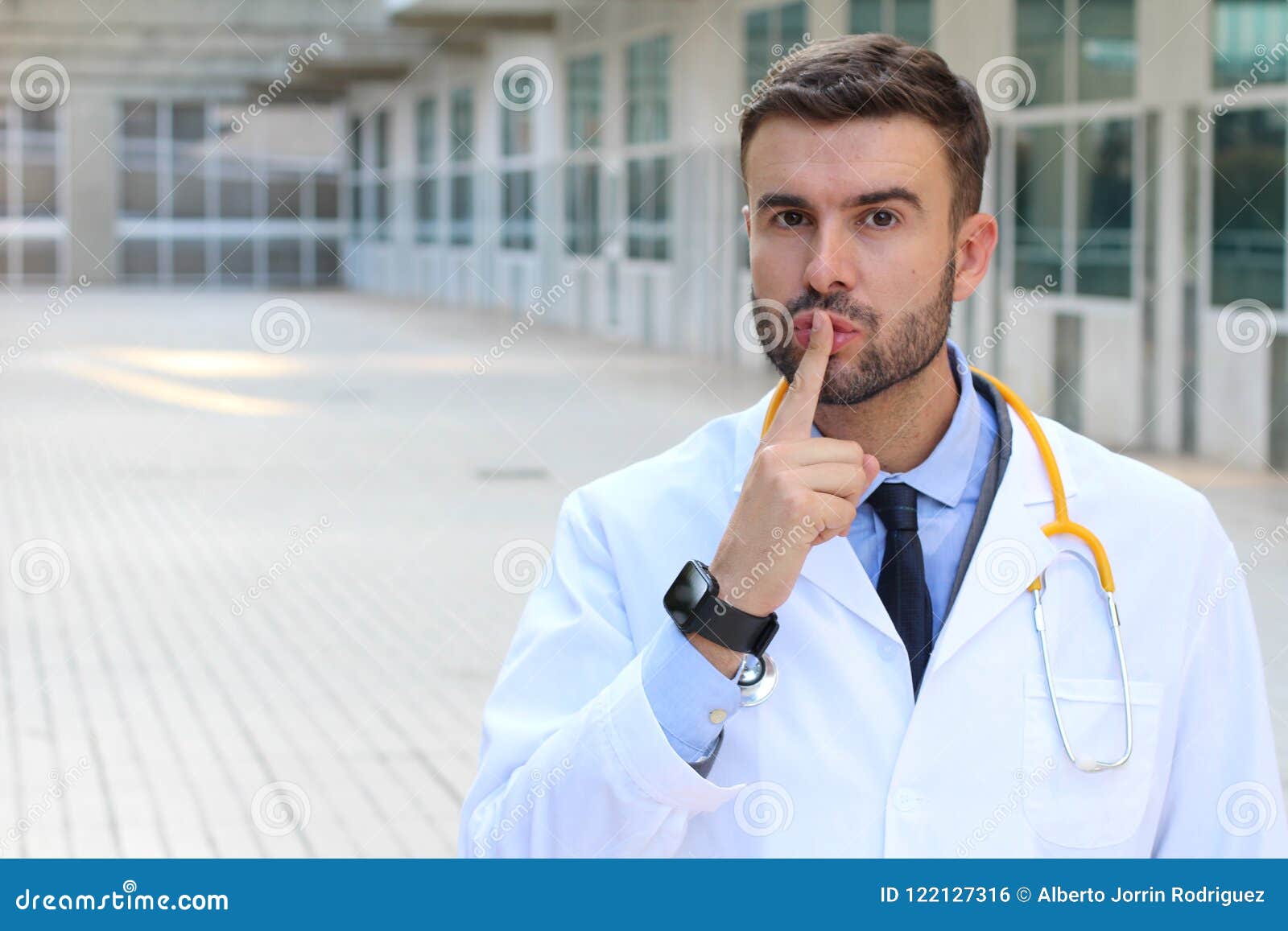 Doctor Requesting Silence in Hospital Stock Photo - Image of caucasian ...