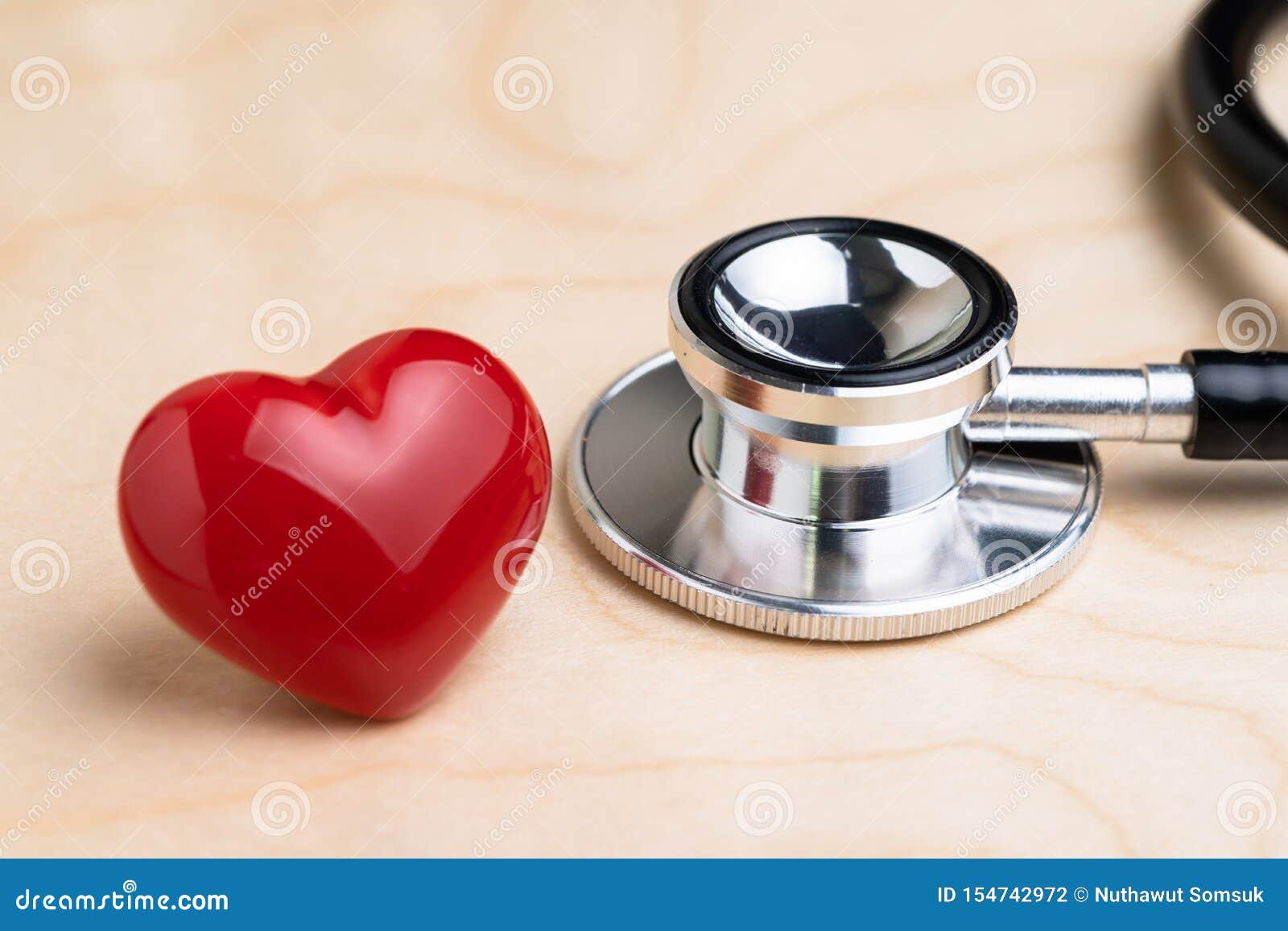 Doctor`s Stethoscope with Shinny Red Heart on Wooden Table, Health Care ... Doctor`s Stethoscope with Shinny Red Heart on Wooden Table, Health Care ...
