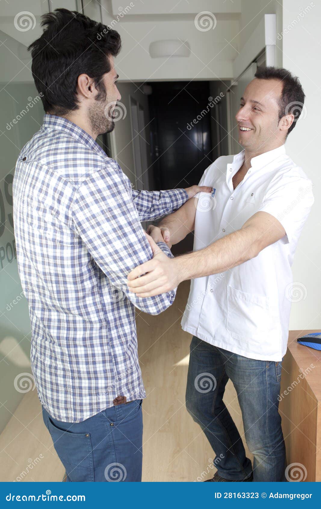 Doctor Saying Hello To Patient Stock Image - Image of smile, jeans ...