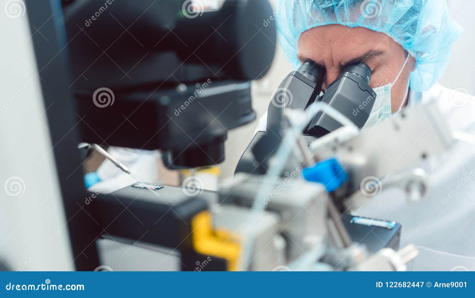 Doctor or Scientist Looking through Microscope in Lab Stock Image ...
