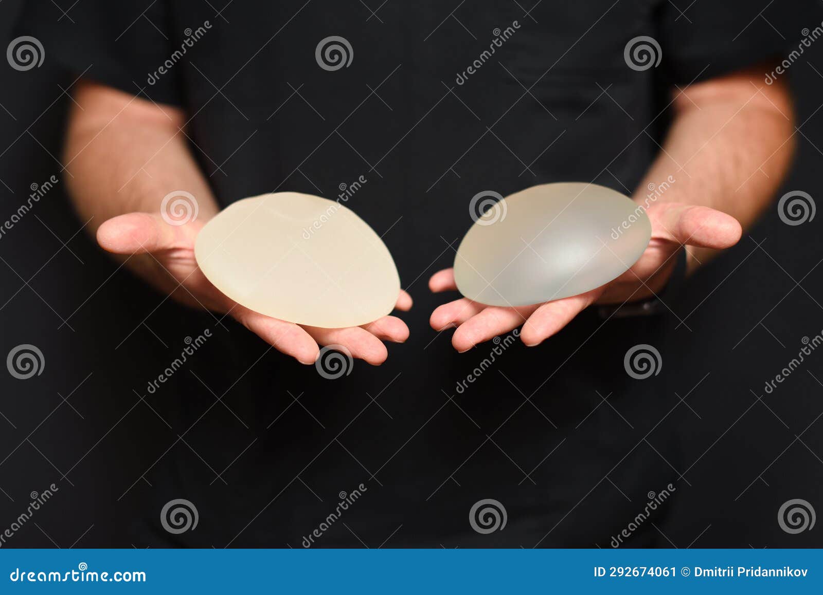 A Doctor Showing Breast Augmentation Implants in Her Hands Stock Image ...