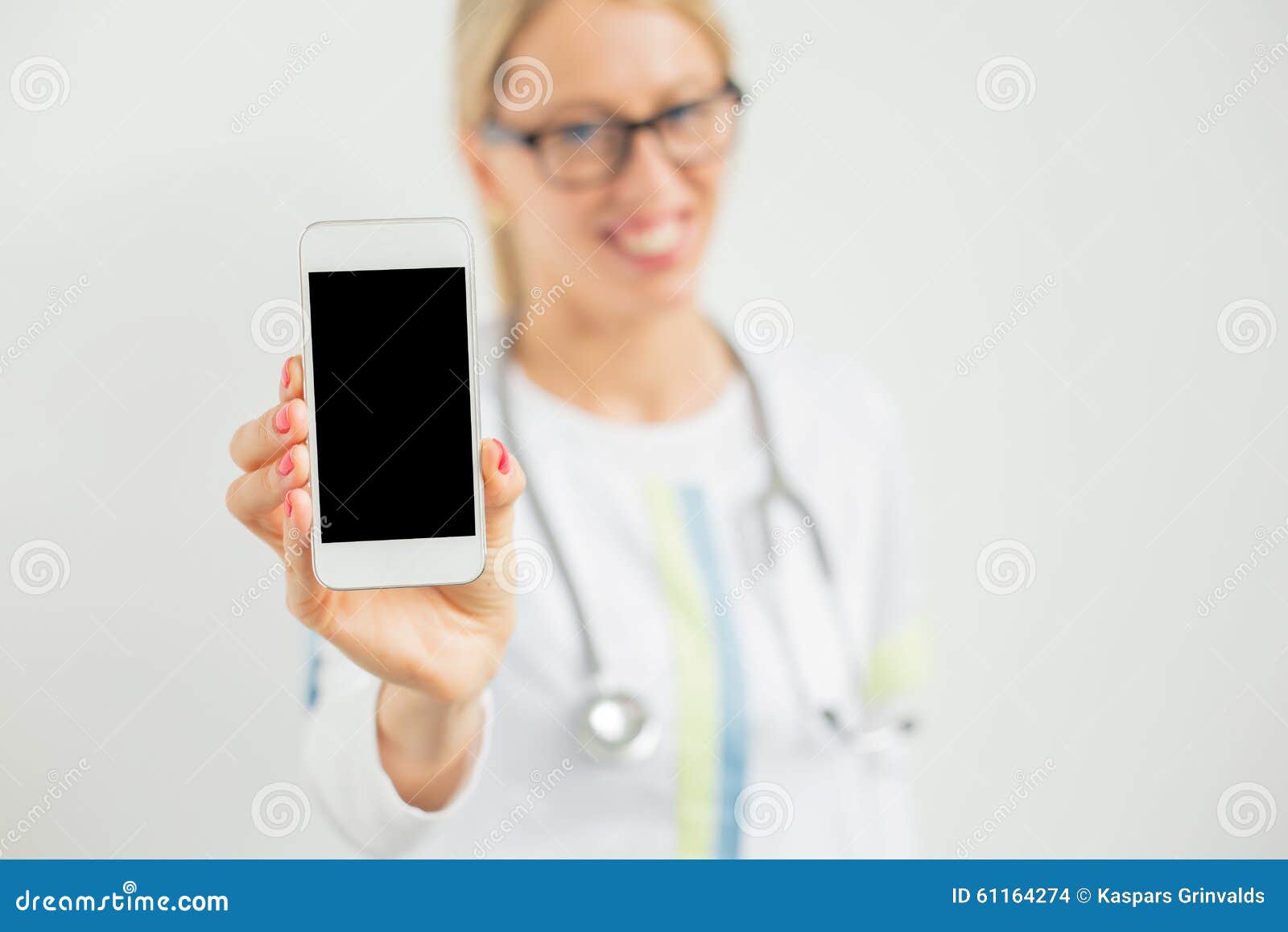 Doctor showing her phone stock photo. Image of device - 61164274
