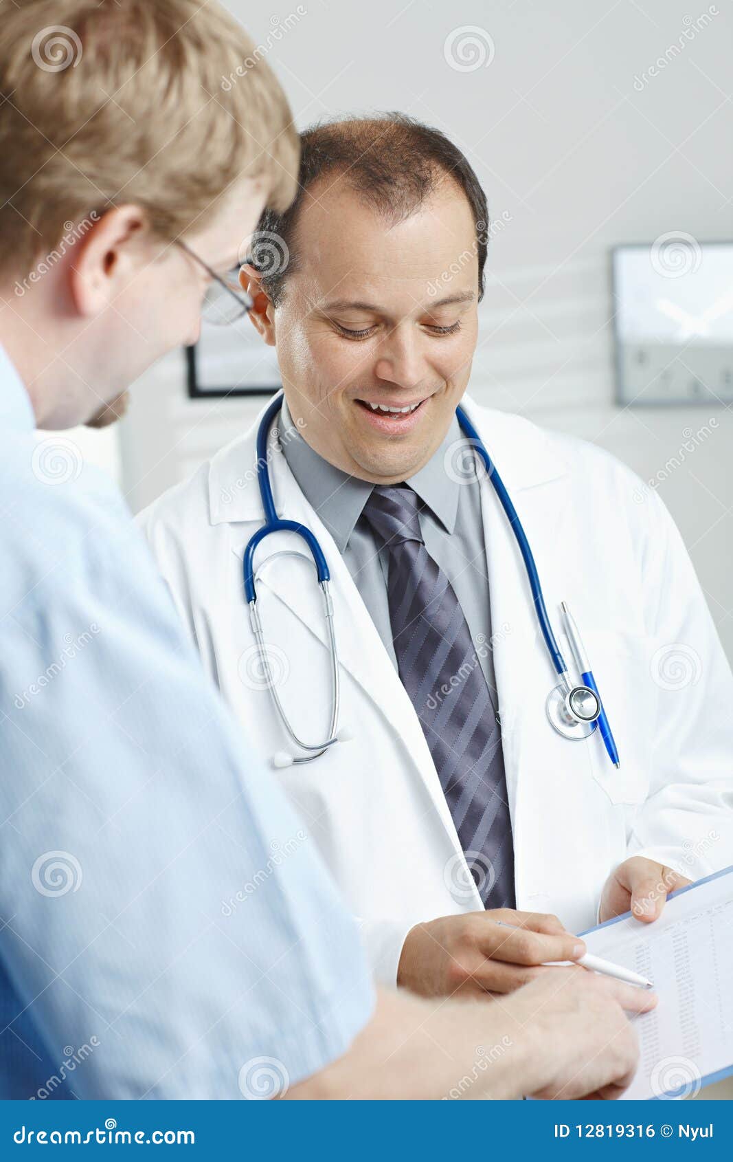 Doctor Showing Test Results Stock Photo - Image of casual, color: 12819316