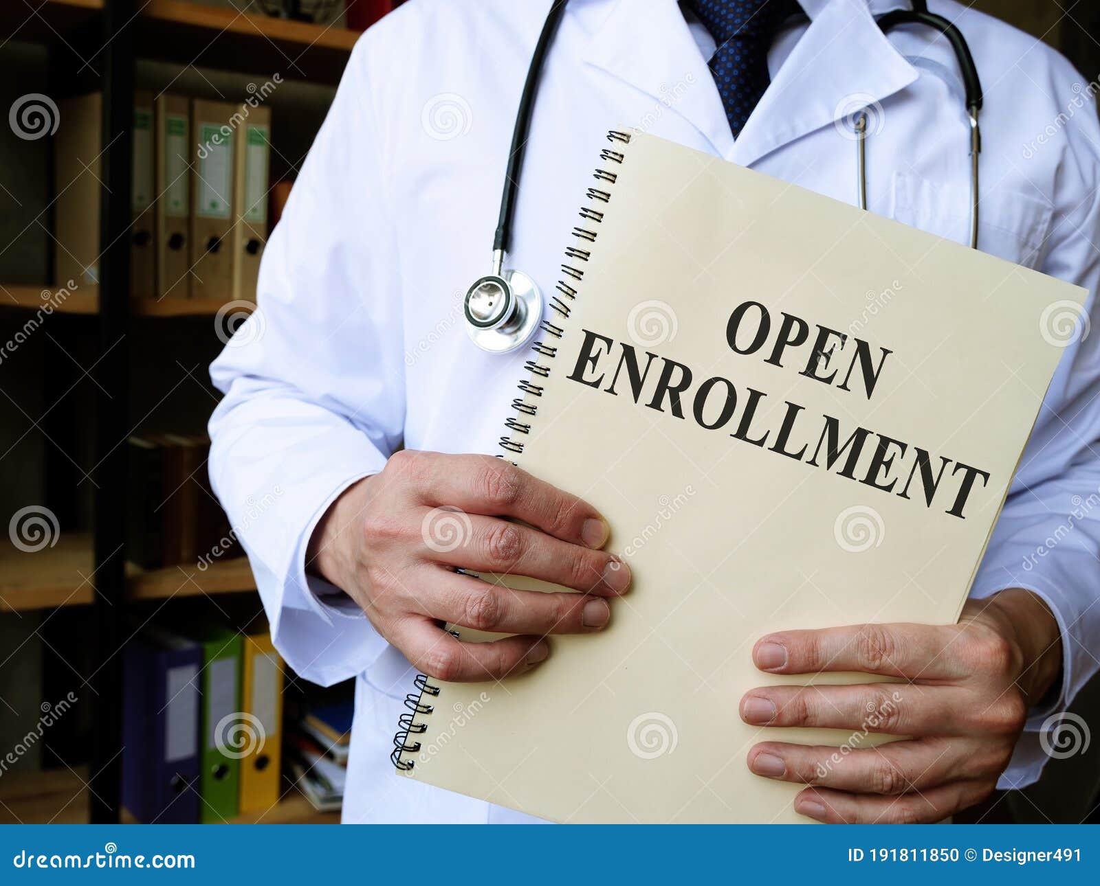 Doctor Shows Annual Open Enrollment Stack of Papers. Stock Photo ...