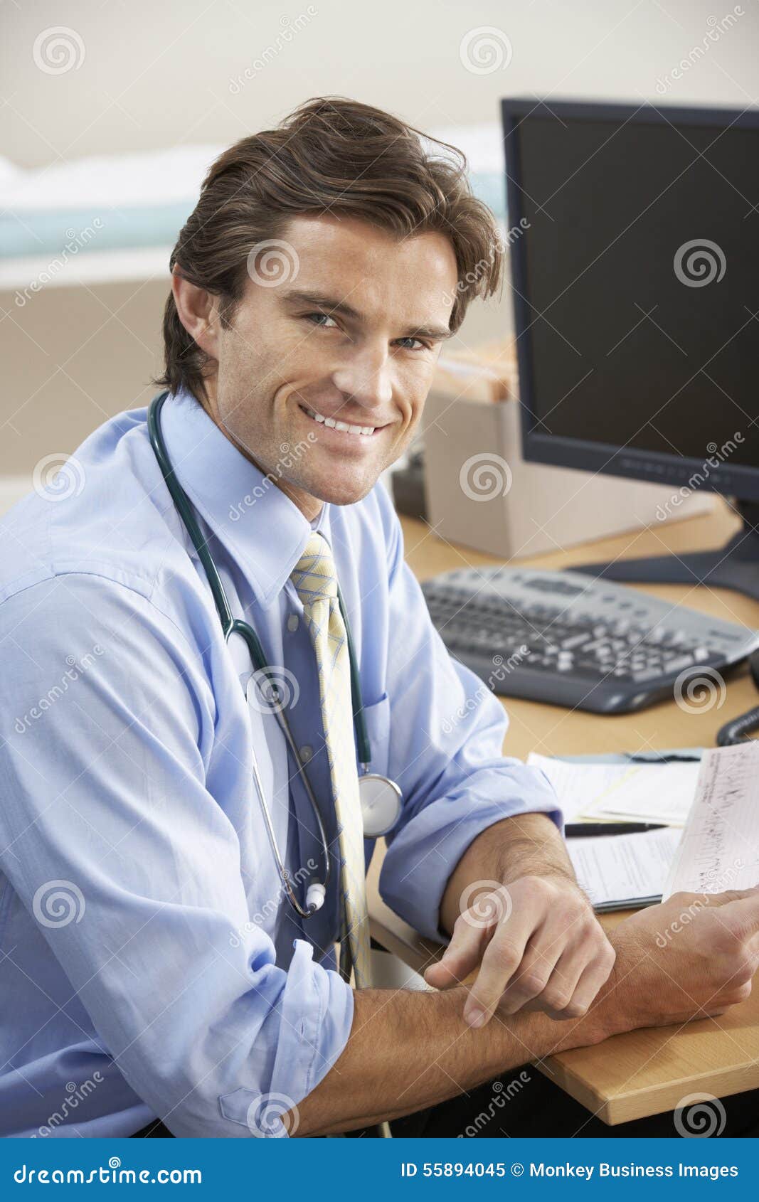 Doctor sitting at desk stock image. Image of service - 55894045