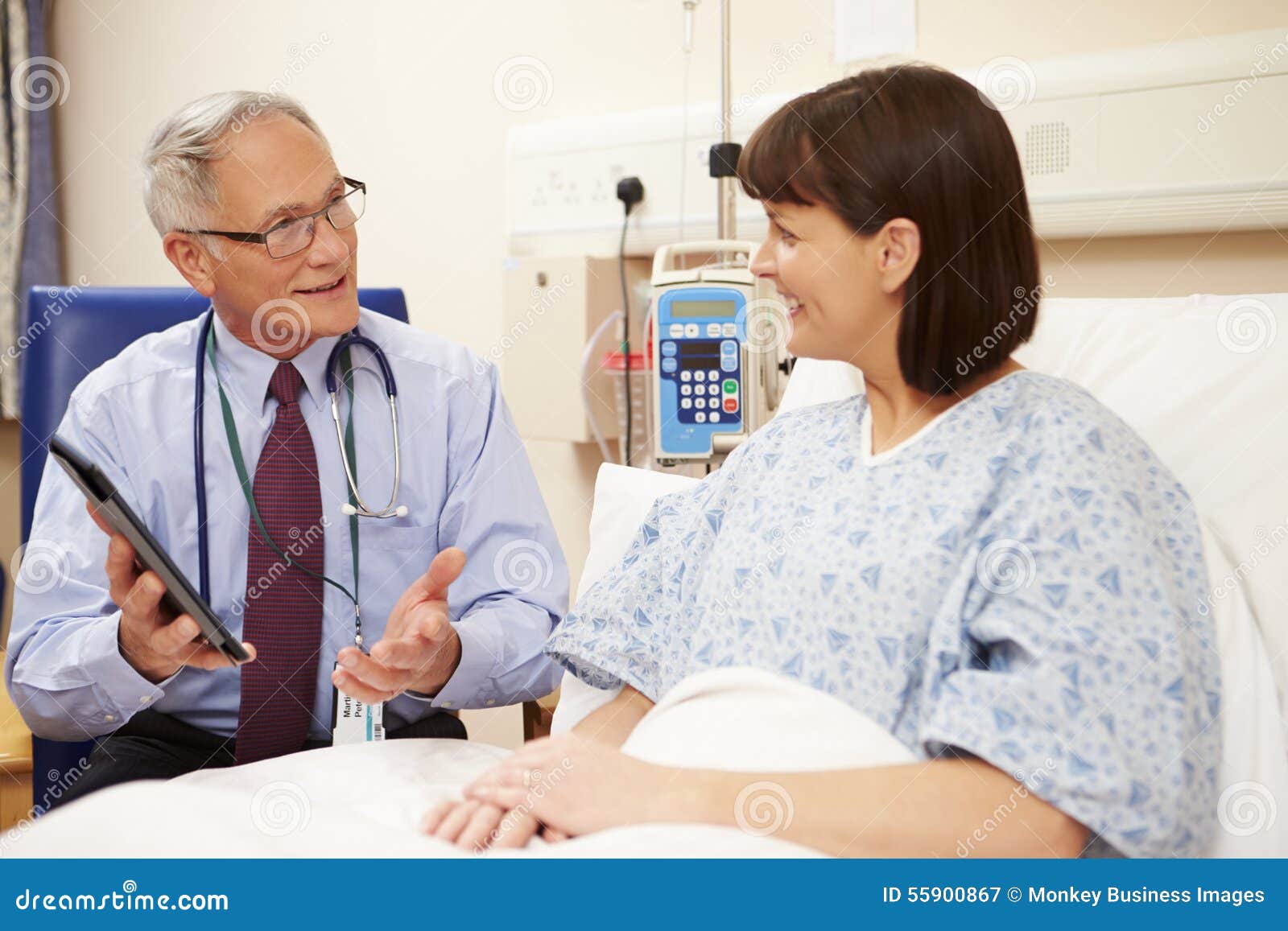 Doctor Sitting by Female Patient S Bed Using Digital Tablet Stock Image ...