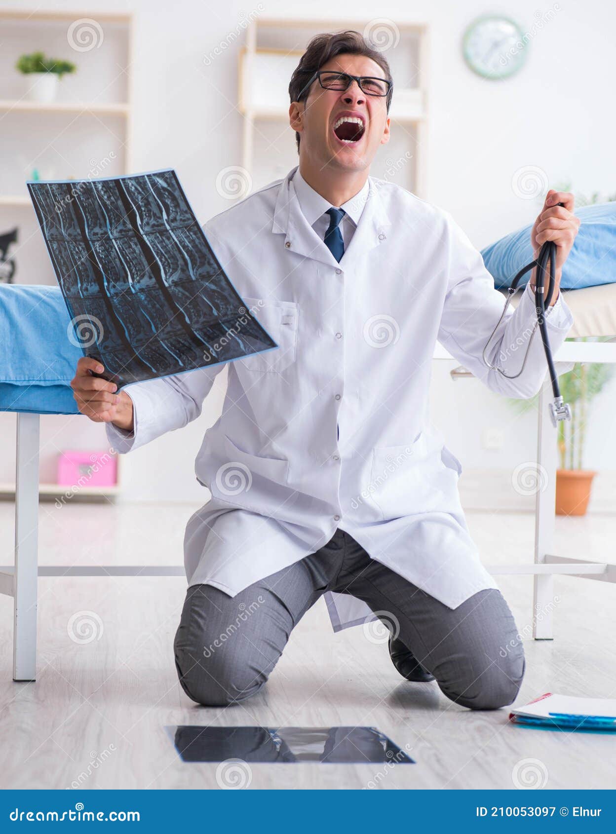 Doctor Sitting on the Floor in Hospital Stock Image - Image of clinic ...