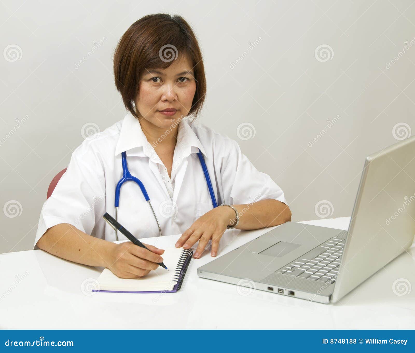 Doctor Sitting at Her Desk in Her Office Stock Photo - Image of woman ...