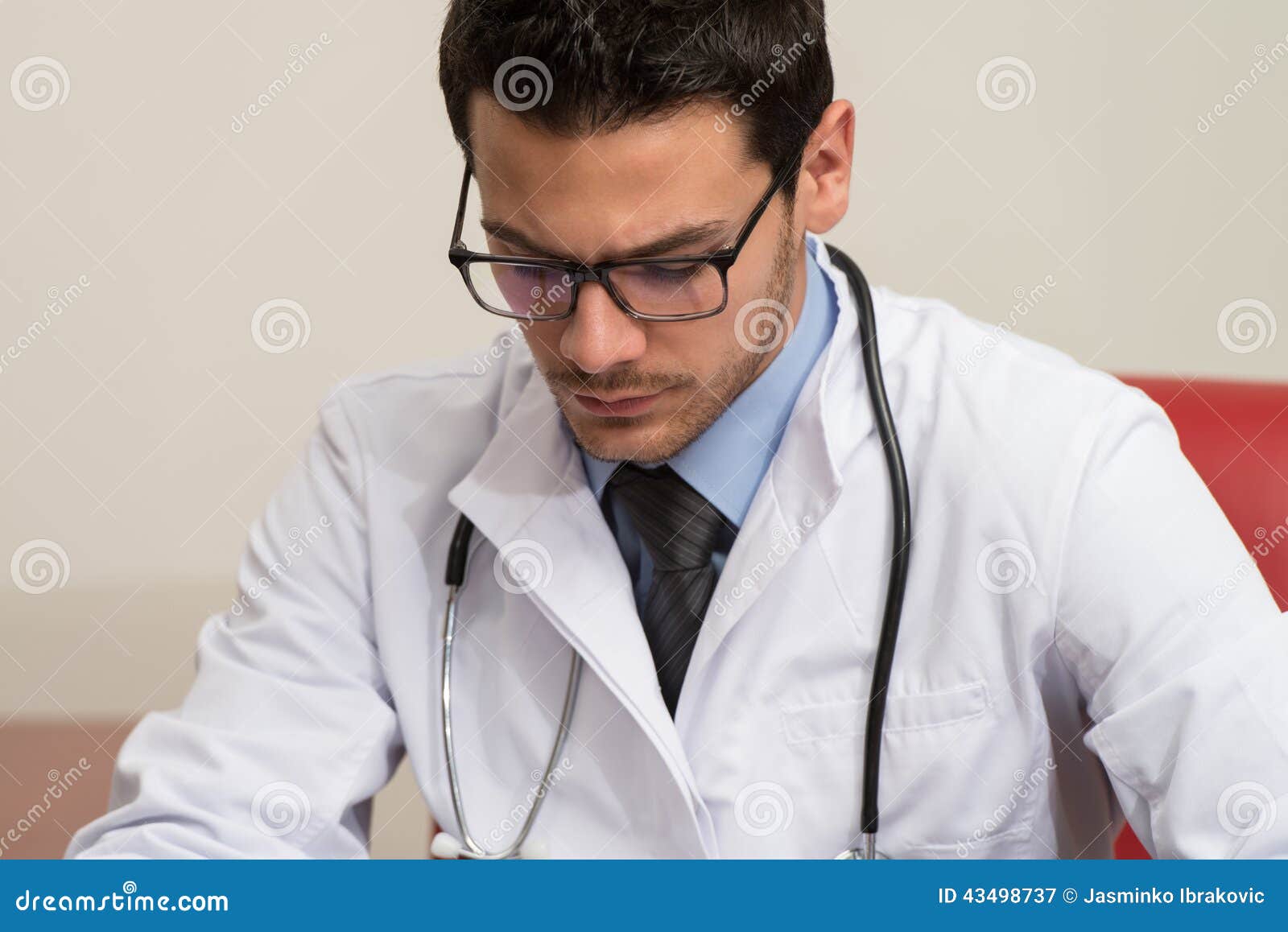 Doctor Sitting at Office Desk Signing a Contract Stock Image - Image of ...