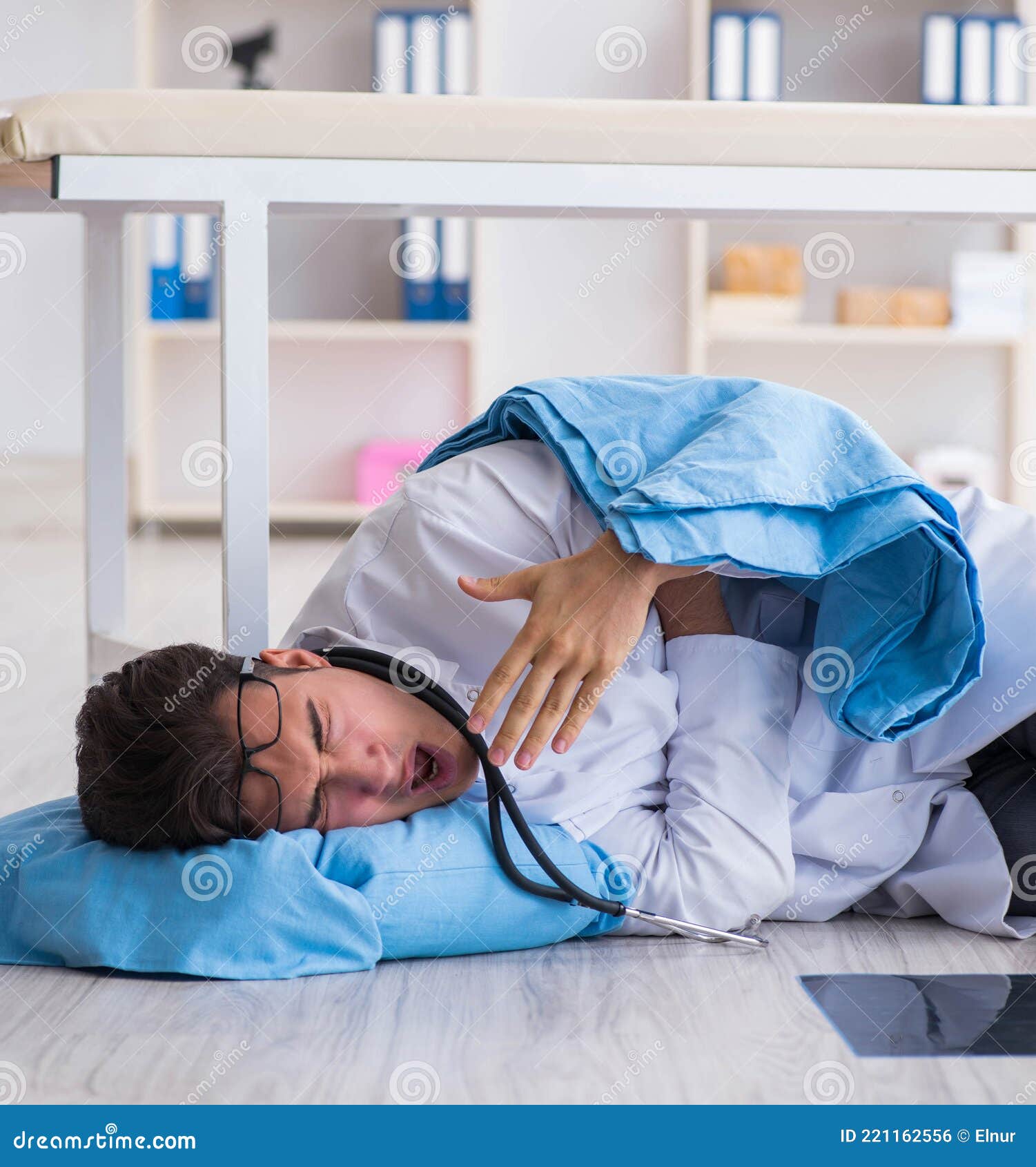 Doctor Sleeping on Floor after Long Night Shift Stock Photo - Image of ...