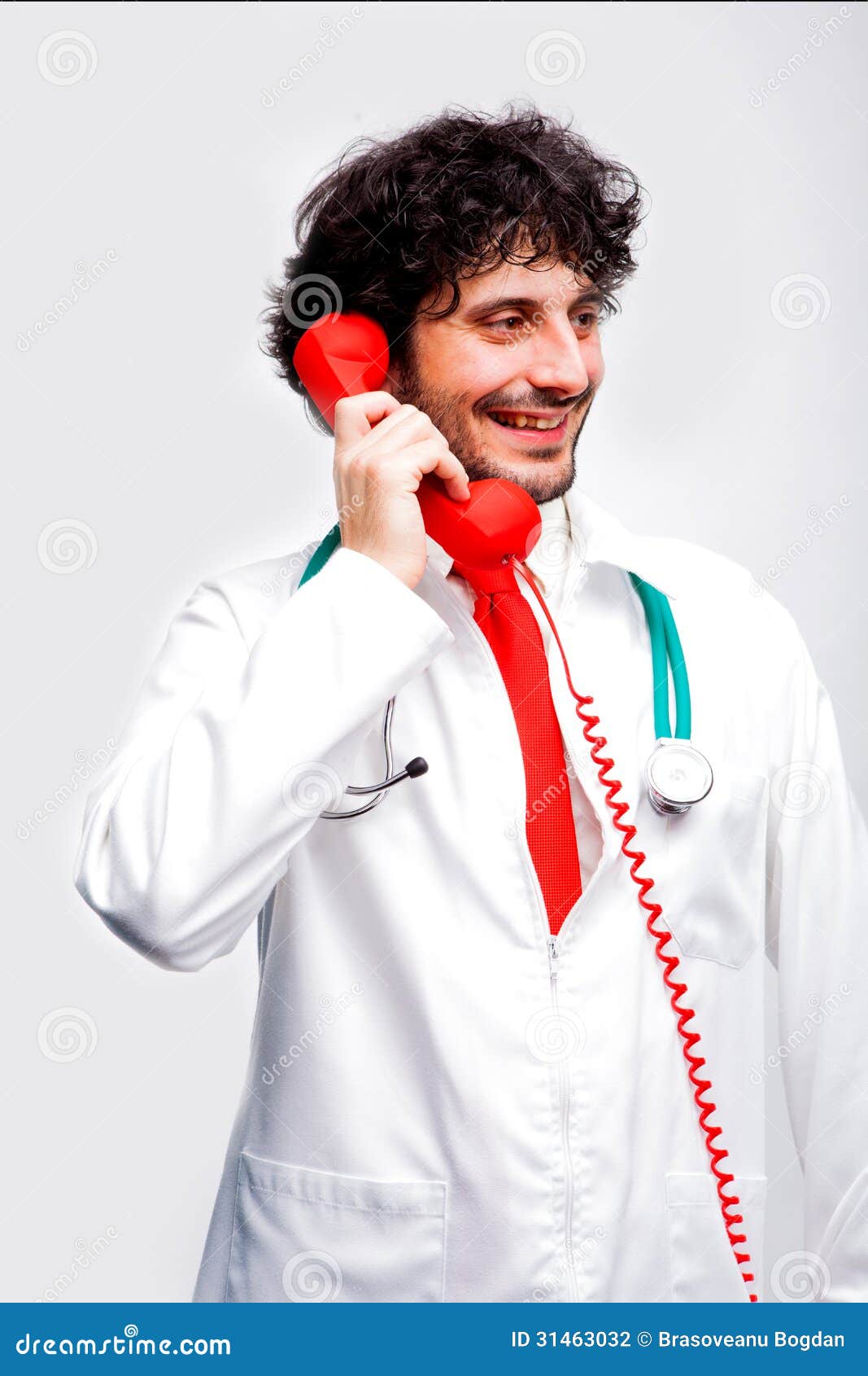Doctor Smiling and Talking at Telephone Stock Photo - Image of hospital ...
