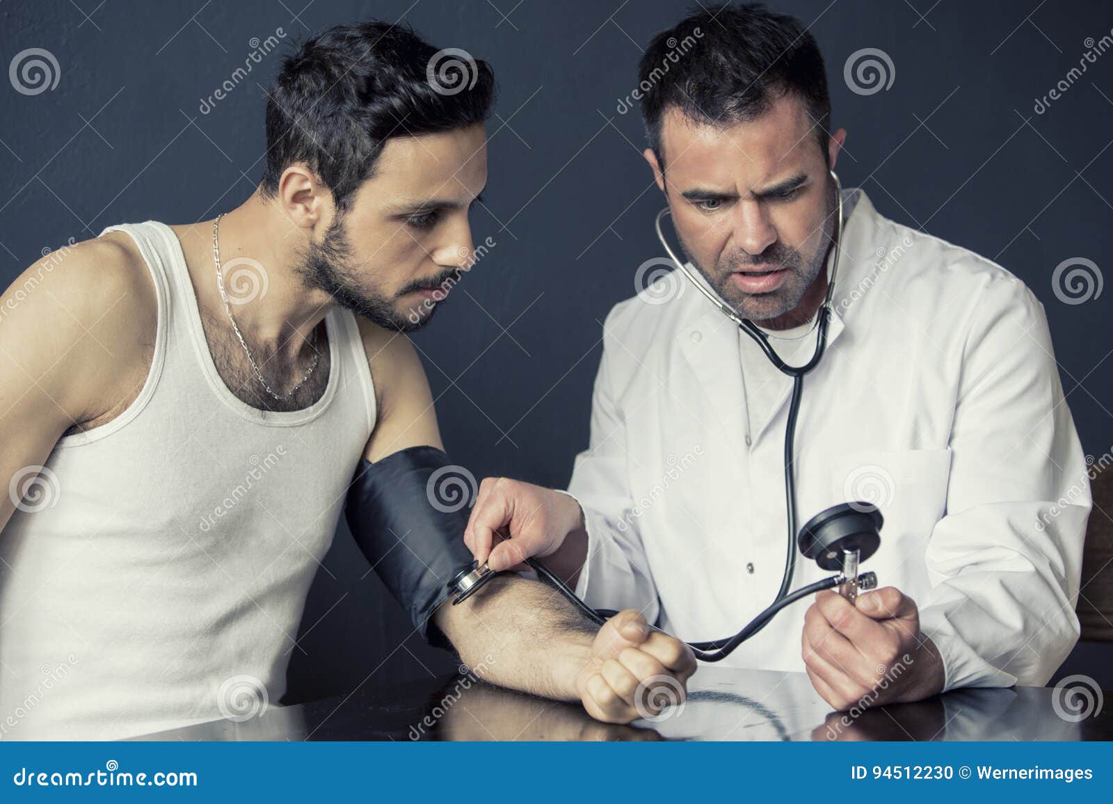 Doctor with Sphygmomanometer Checking Pulse from Patient Stock Photo ...