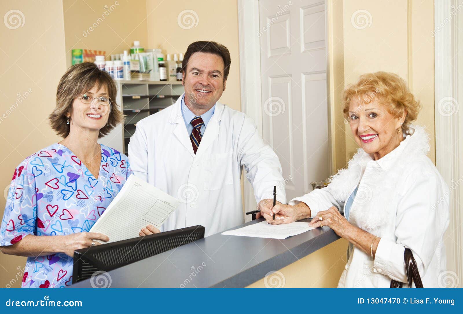 Doctor and Staff Greet Patient Stock Photo - Image of elderly, health ...