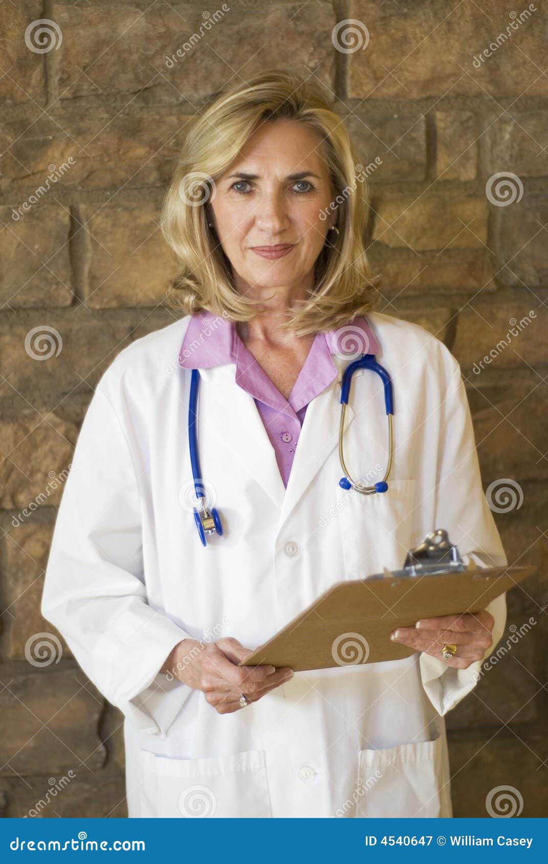 Doctor Standing with Charts Stock Image - Image of desk, spokesperson ...