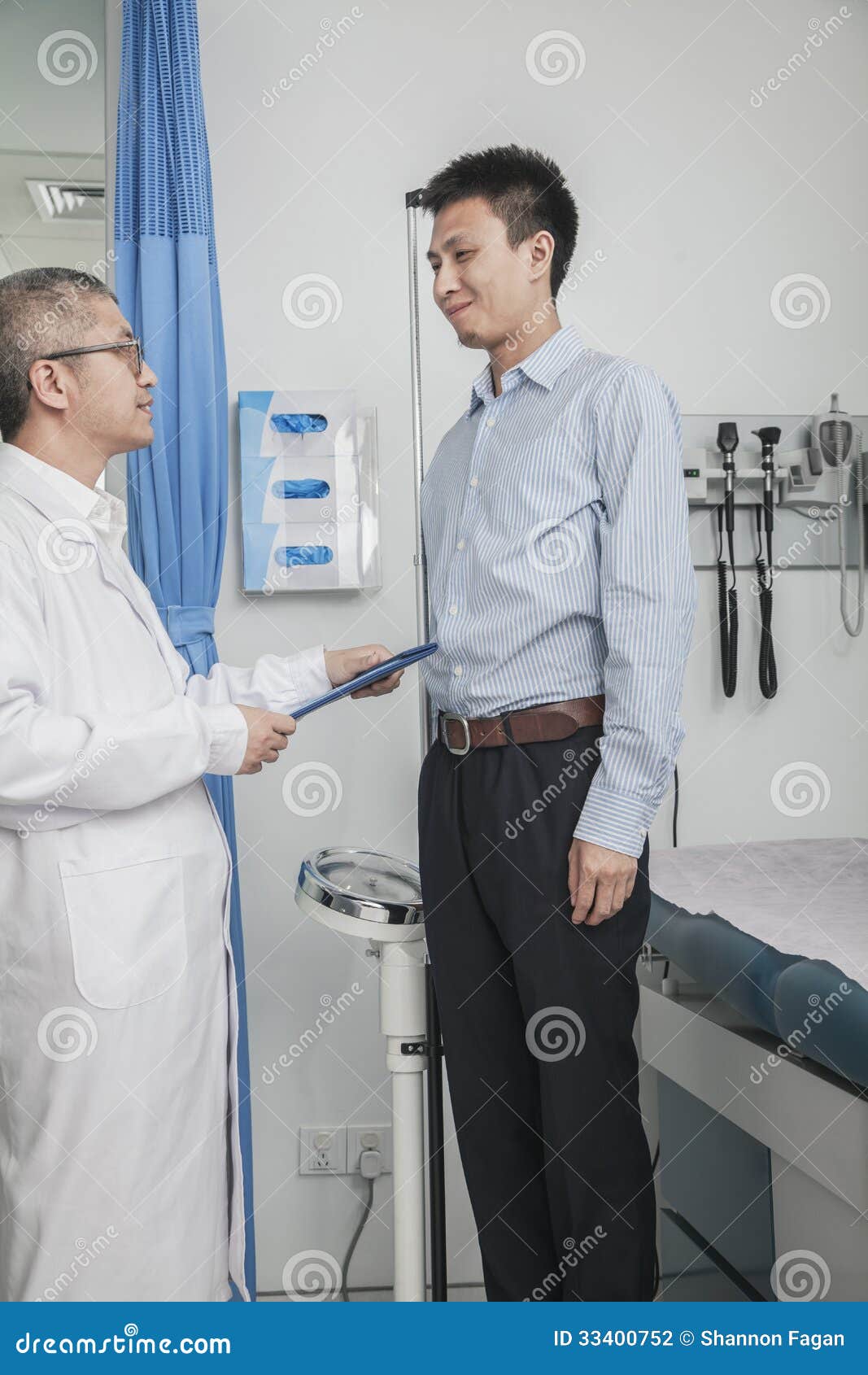 Doctor Standing and Facing a Patient in the Doctors Office Stock Photo ...