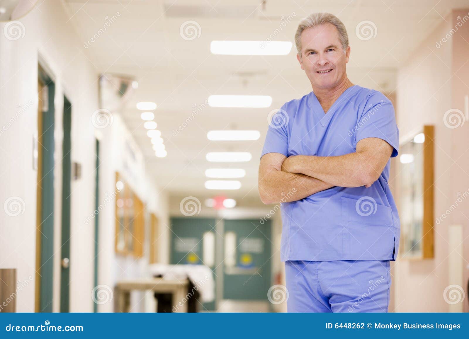 Doctor Standing in a Hospital Corridor Stock Photo - Image of happy ...
