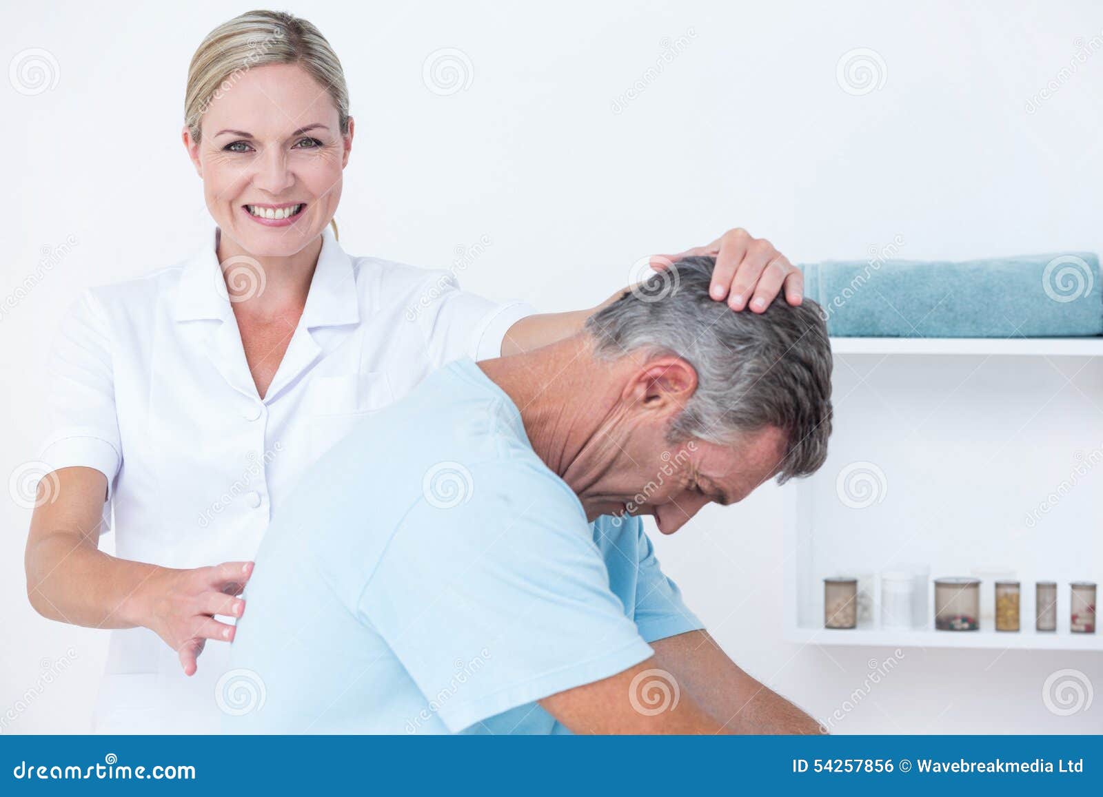 Doctor Stretching a Man Back Stock Photo - Image of alignment, sitting ...
