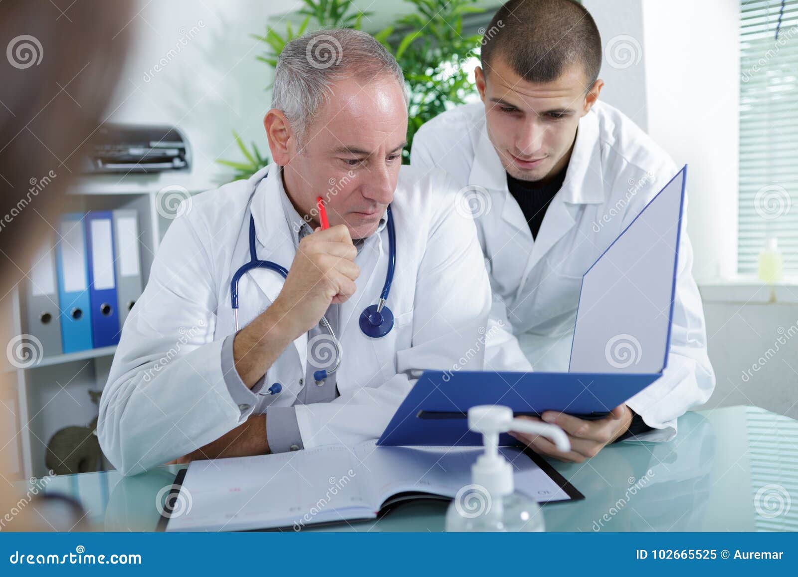 Doctor and Student Doctor Explaining Something Stock Image - Image of ...