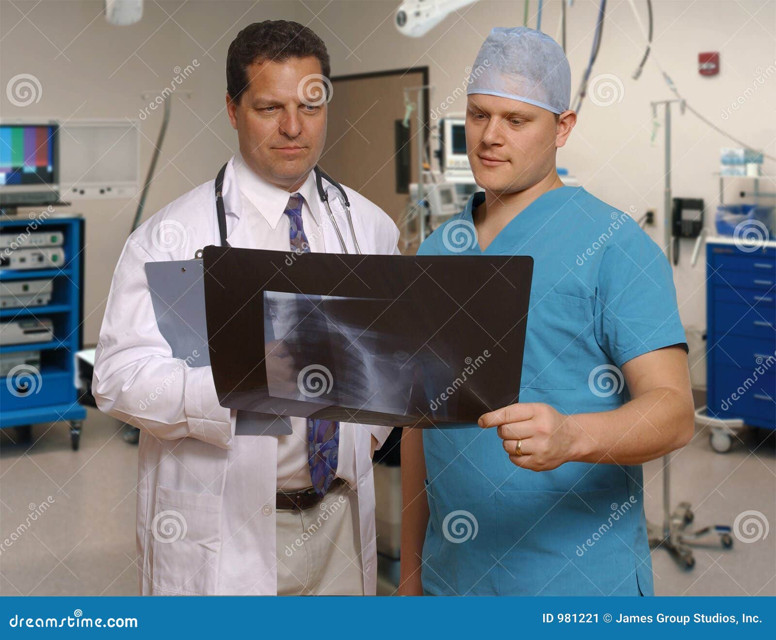 Doctor and Surgeon Reviewing X-ray Stock Image - Image of hospital ...