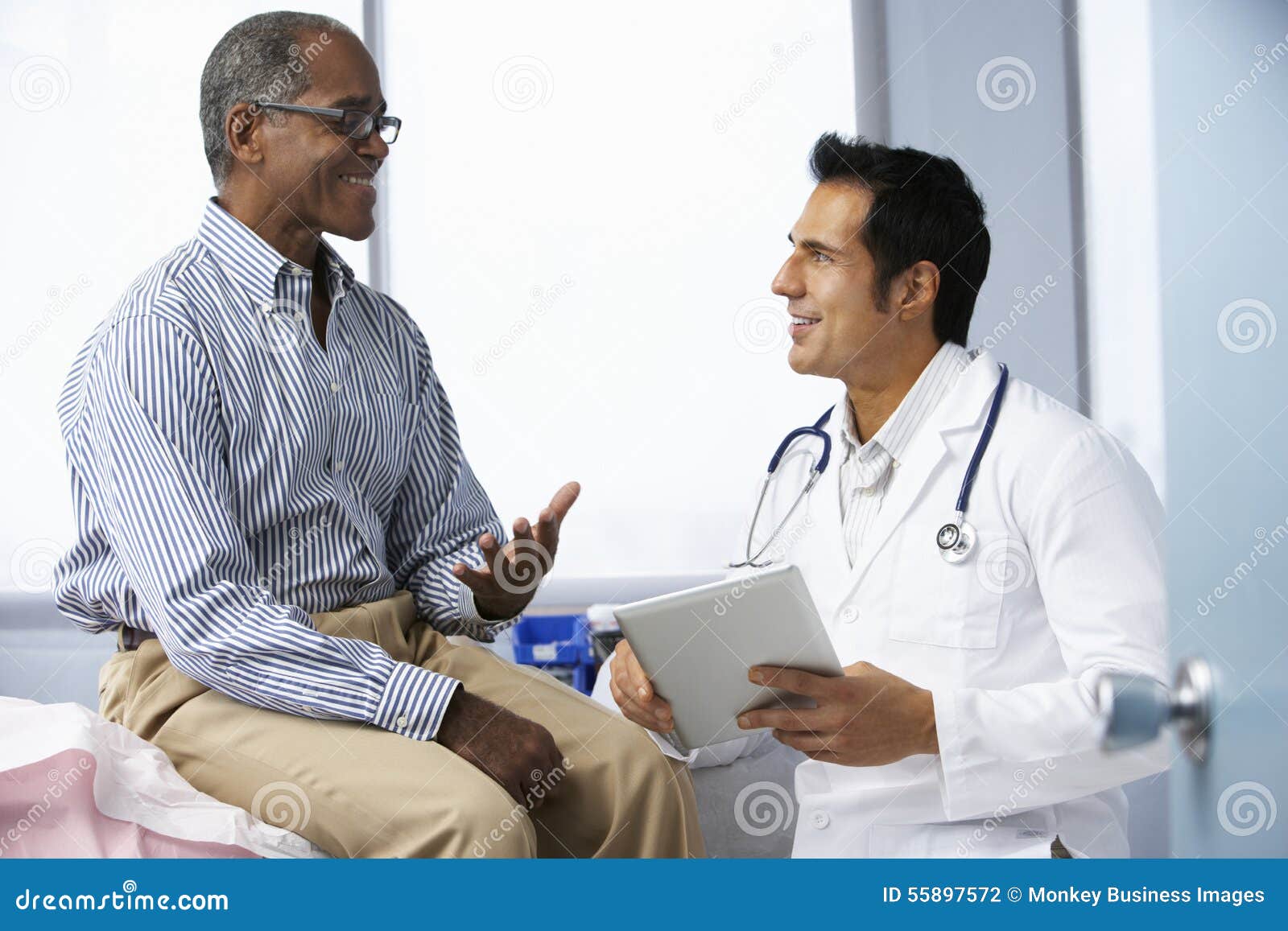 Doctor in Surgery with Male Patient Using Digital Tablet Stock Photo ...