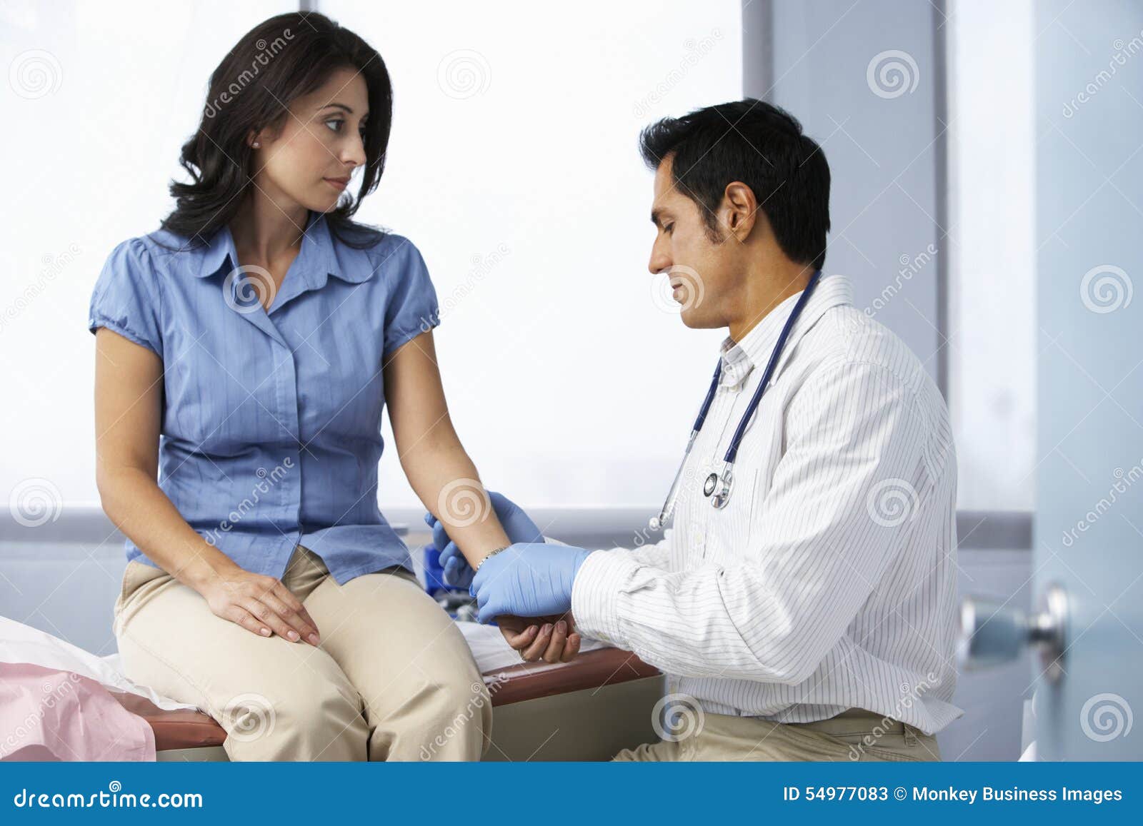 Doctor in Surgery Taking Female Patient S Pulse Stock Image - Image of ...
