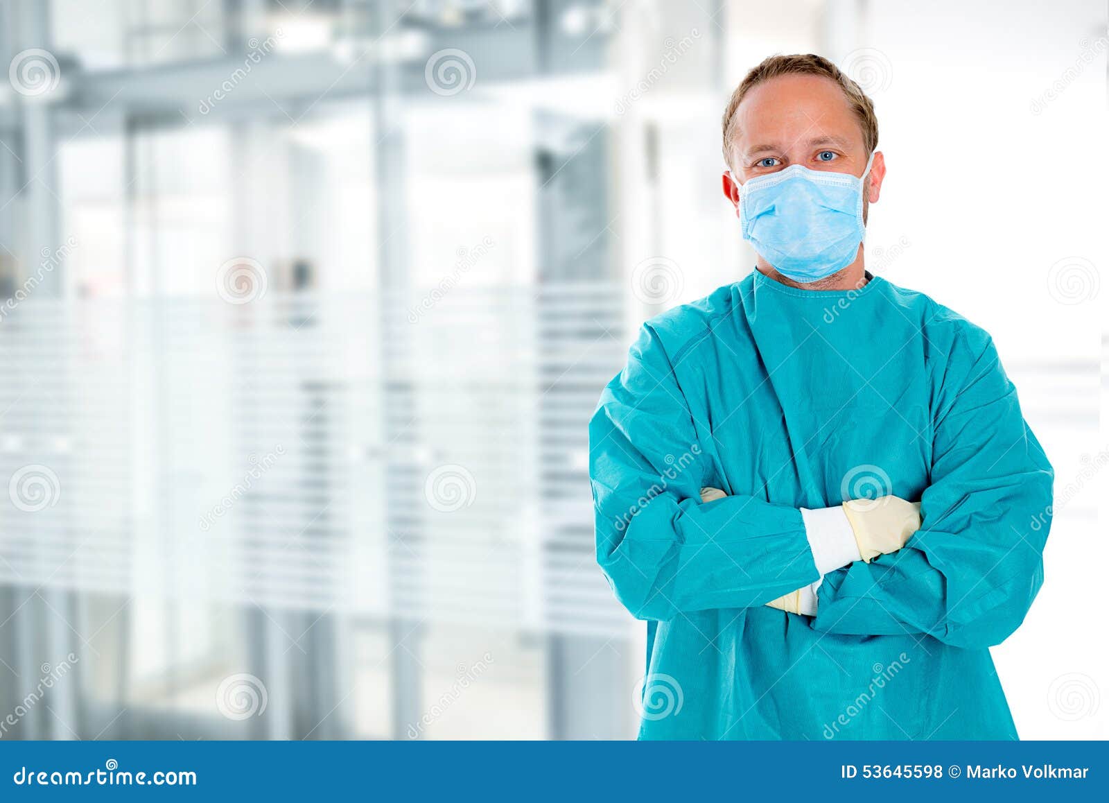 Doctor with Surgical Mask and Green Coat Stock Photo - Image of ...