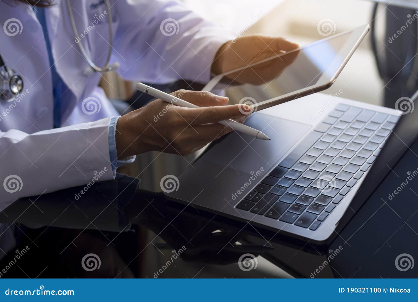 Doctor Using Modern Digital Tablet, Work on Laptop Computer on Office ...