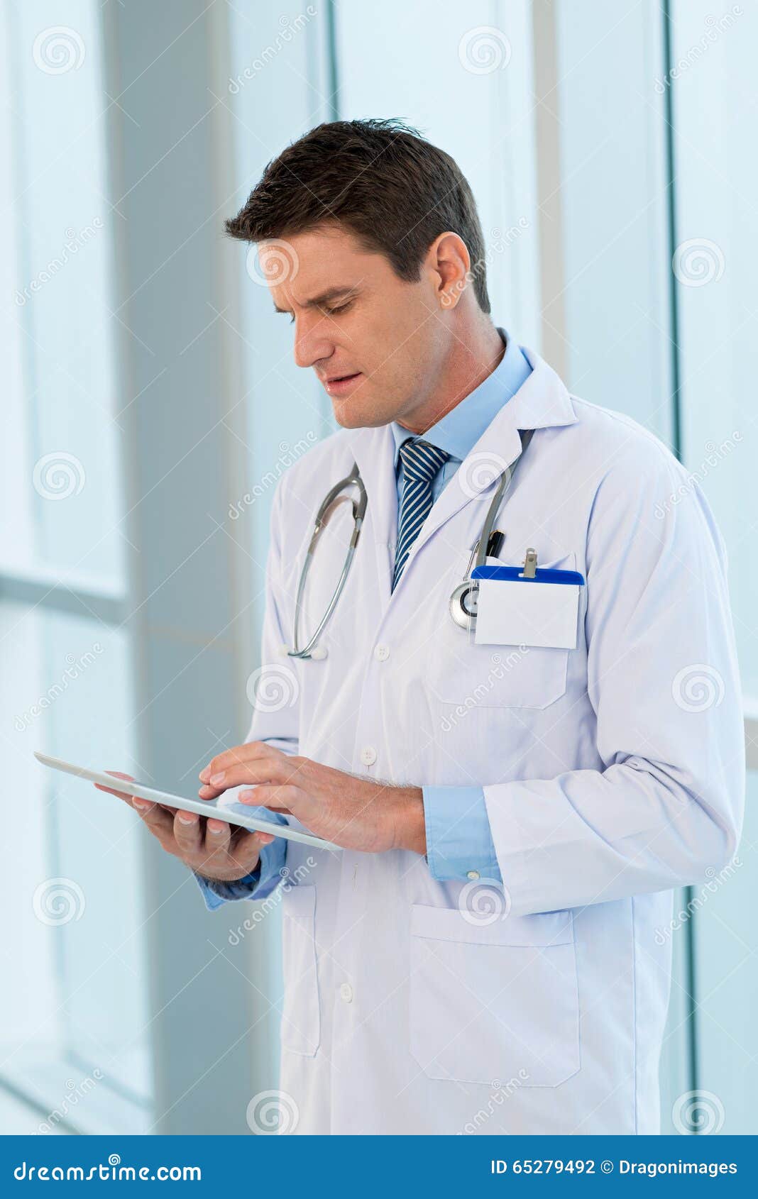Doctor with tablet stock photo. Image of caucasian, interacting - 65279492