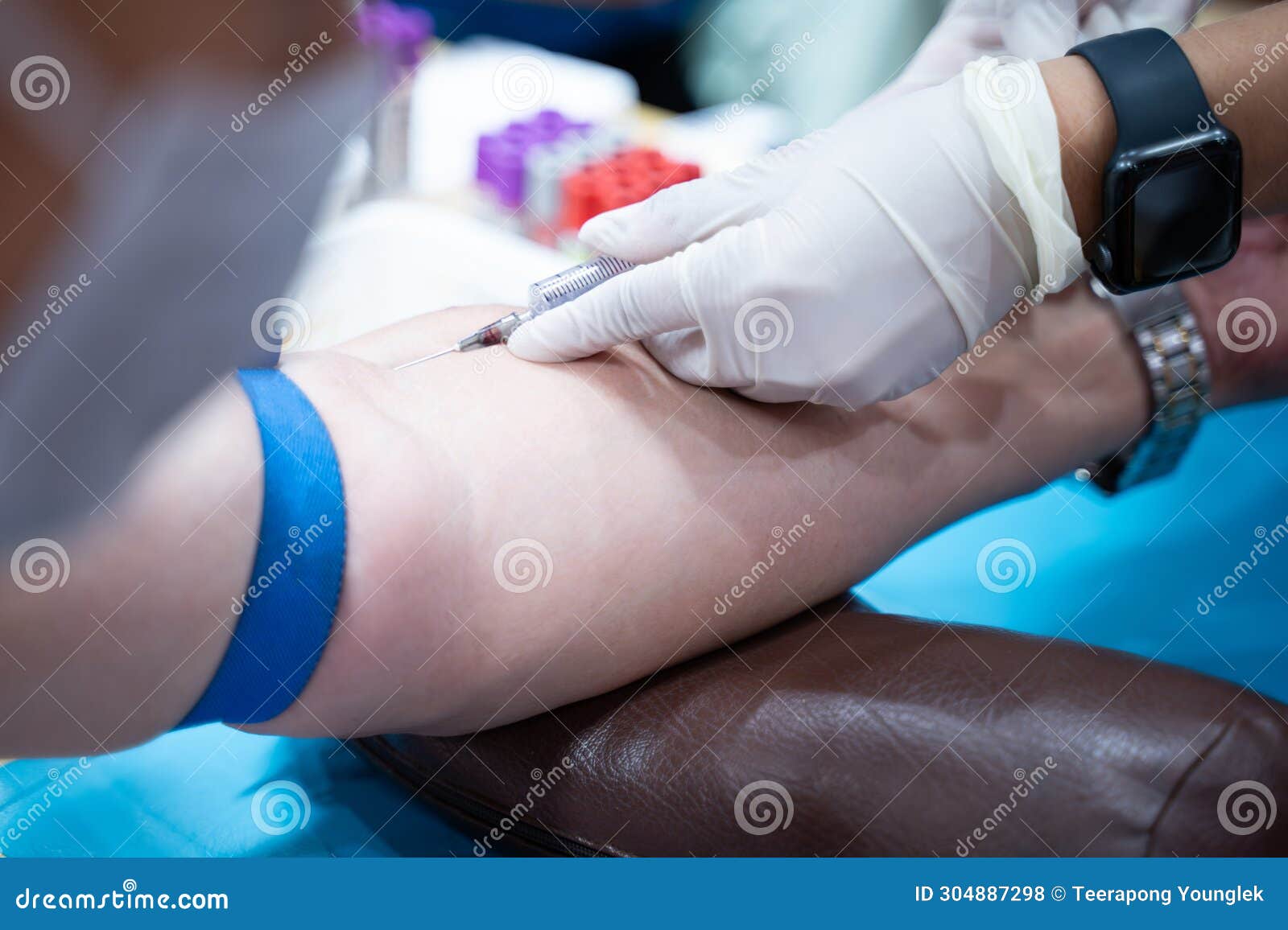 The Doctor is Taking a Blood Sample from the Patient& X27;s Arm for ...