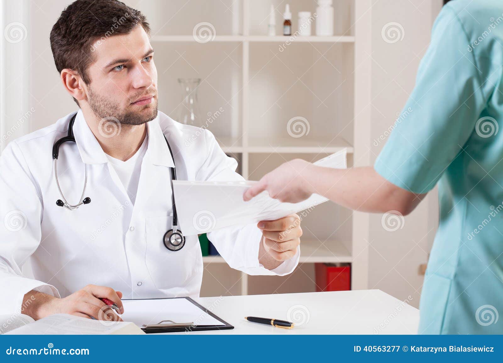 Doctor Taking Documents from a Nurse Stock Image - Image of laboratory ...