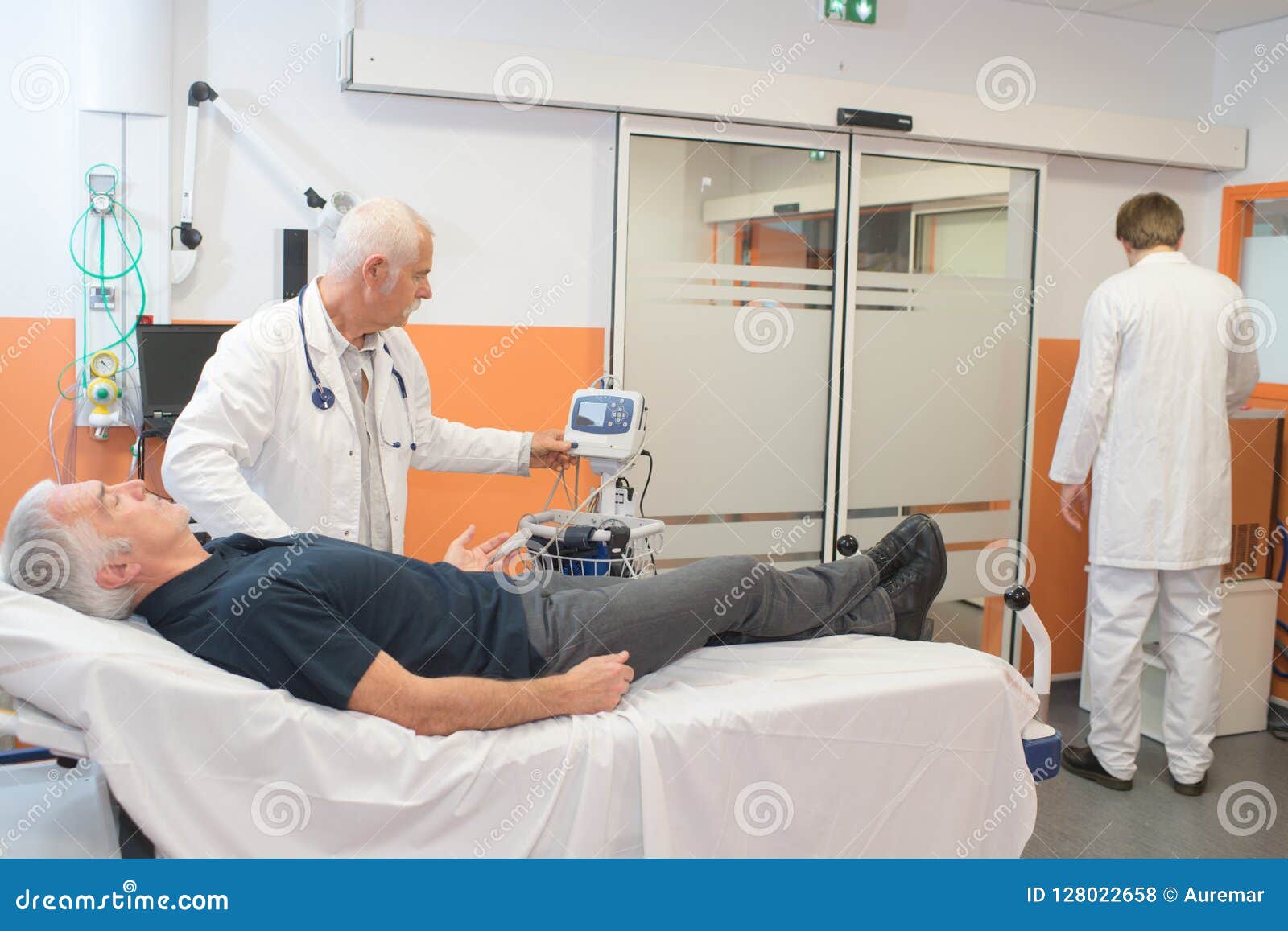 Doctor taking man`s pulse stock photo. Image of gauge - 128022658