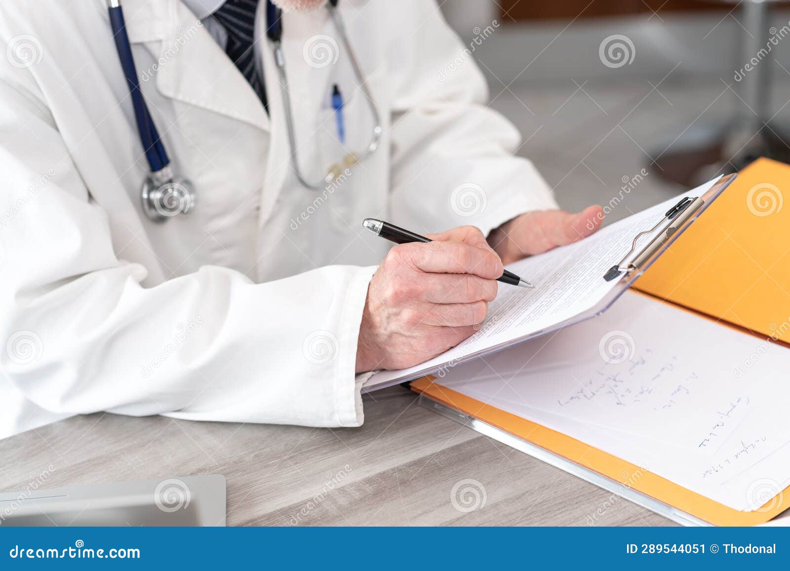 Doctor Taking Notes on Clipboard Stock Image - Image of form ...