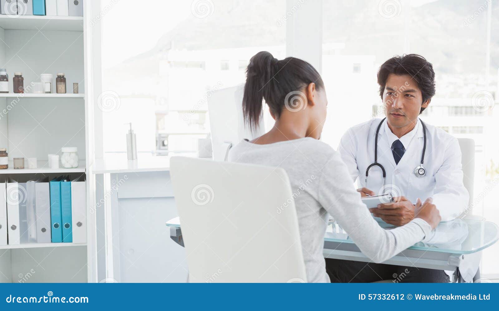 Doctor Taking Notes from Patient Stock Photo - Image of looking ...