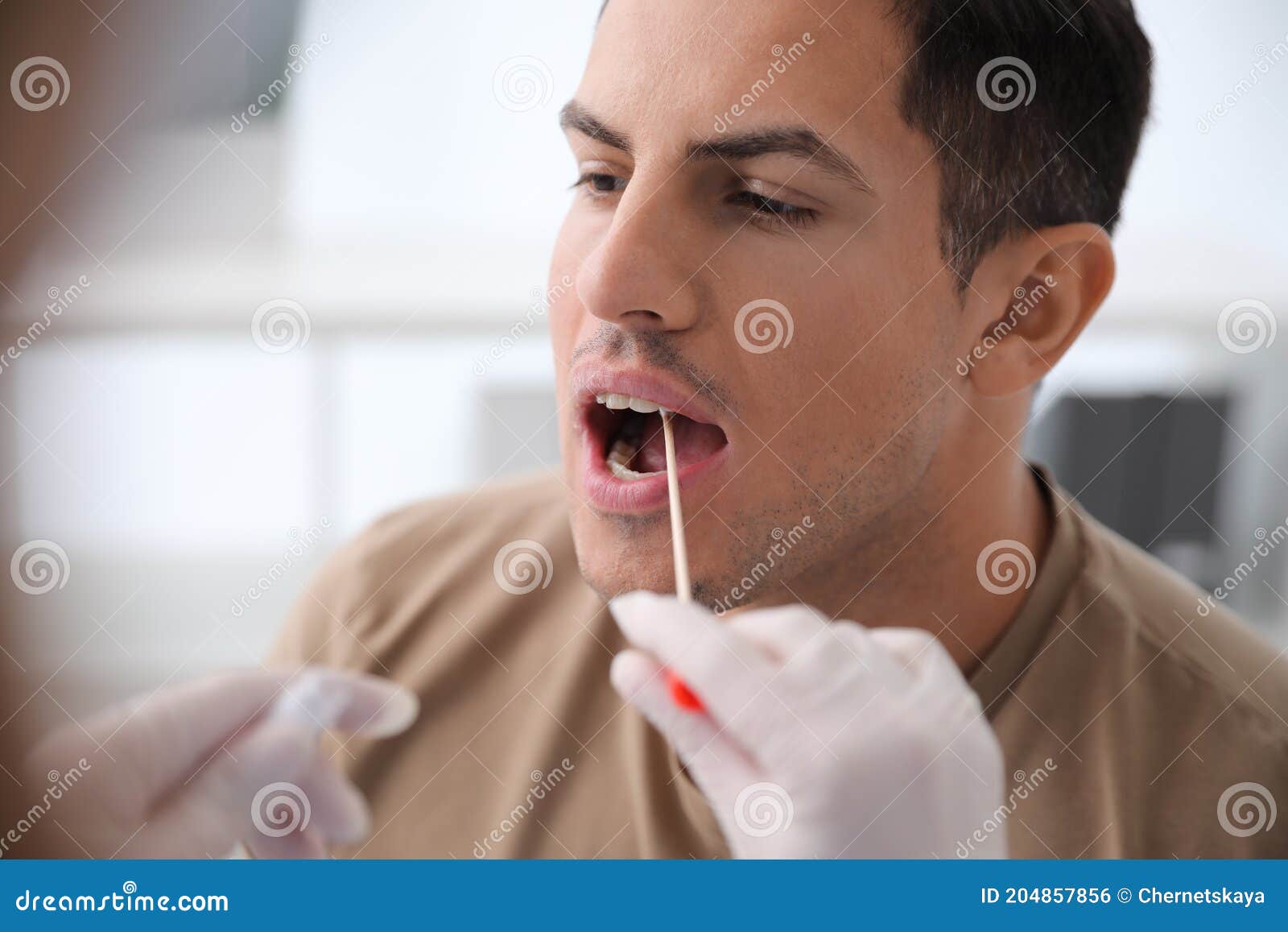 Doctor Taking Sample for DNA Test from Man in Clinic Stock Photo ...