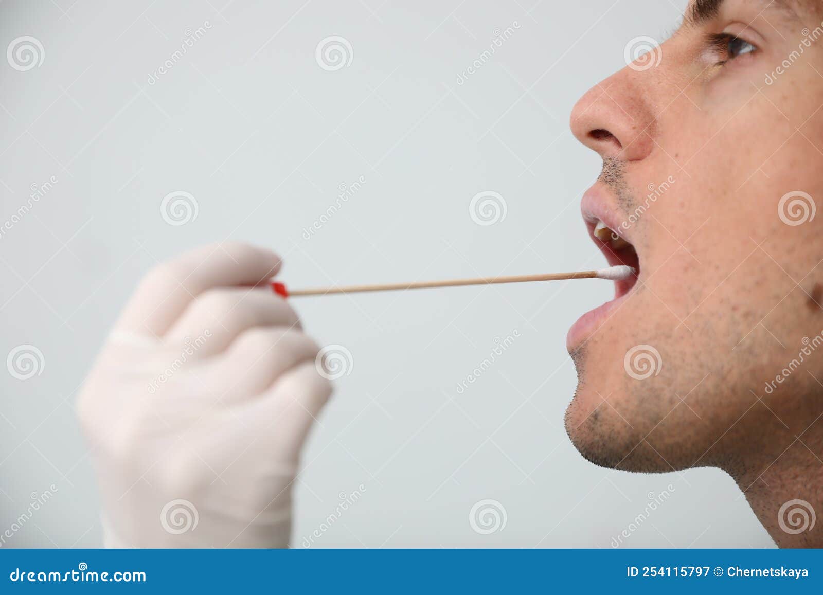 Doctor Taking Sample for DNA Test from Man on Light Background Stock ...