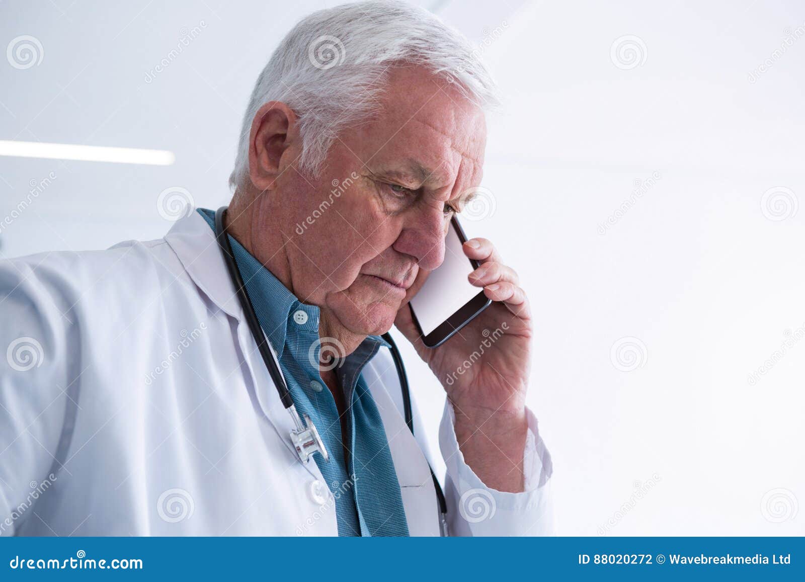 Doctor Talking on His Mobile Phone in the Passageway Stock Photo ...
