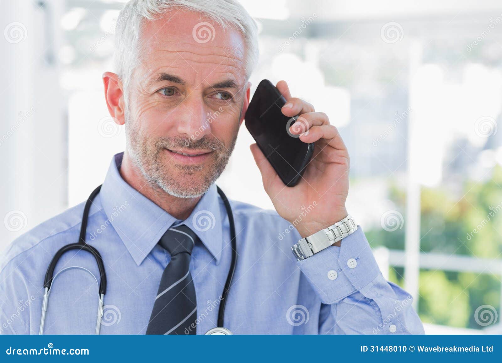 Doctor Talking on the Phone Stock Photo - Image of healthcare, male ...