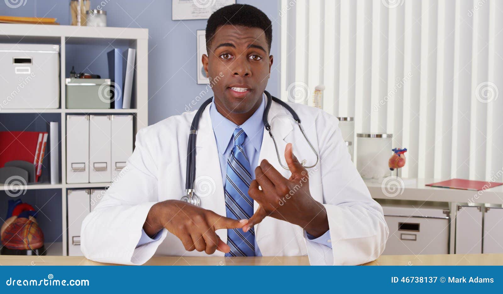 Doctor talking to camera stock image. Image of medicine - 46738137