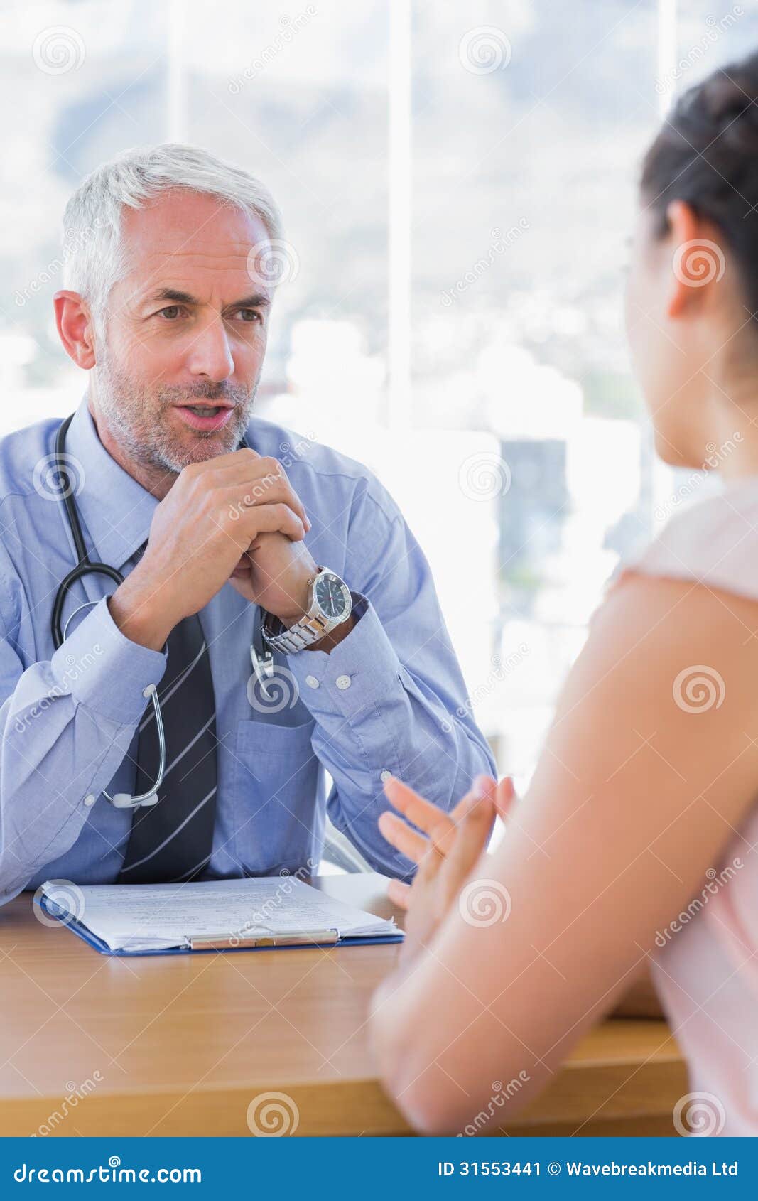 Doctor talking to patient stock image. Image of examination - 31553441