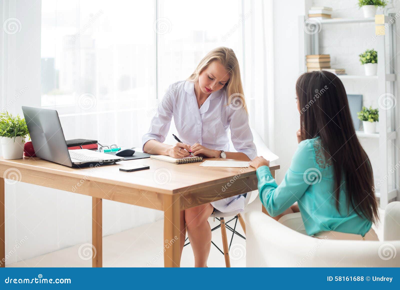 Doctor Talking To Patient in Office, Taking Notes. Stock Photo - Image ...
