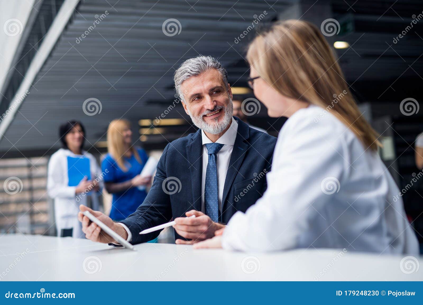 Doctor Talking To a Pharmaceutical Sales Representative. Stock Photo ...