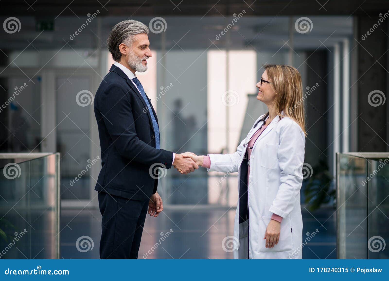 Doctor Talking To Pharmaceutical Sales Representative, Shaking Hands ...